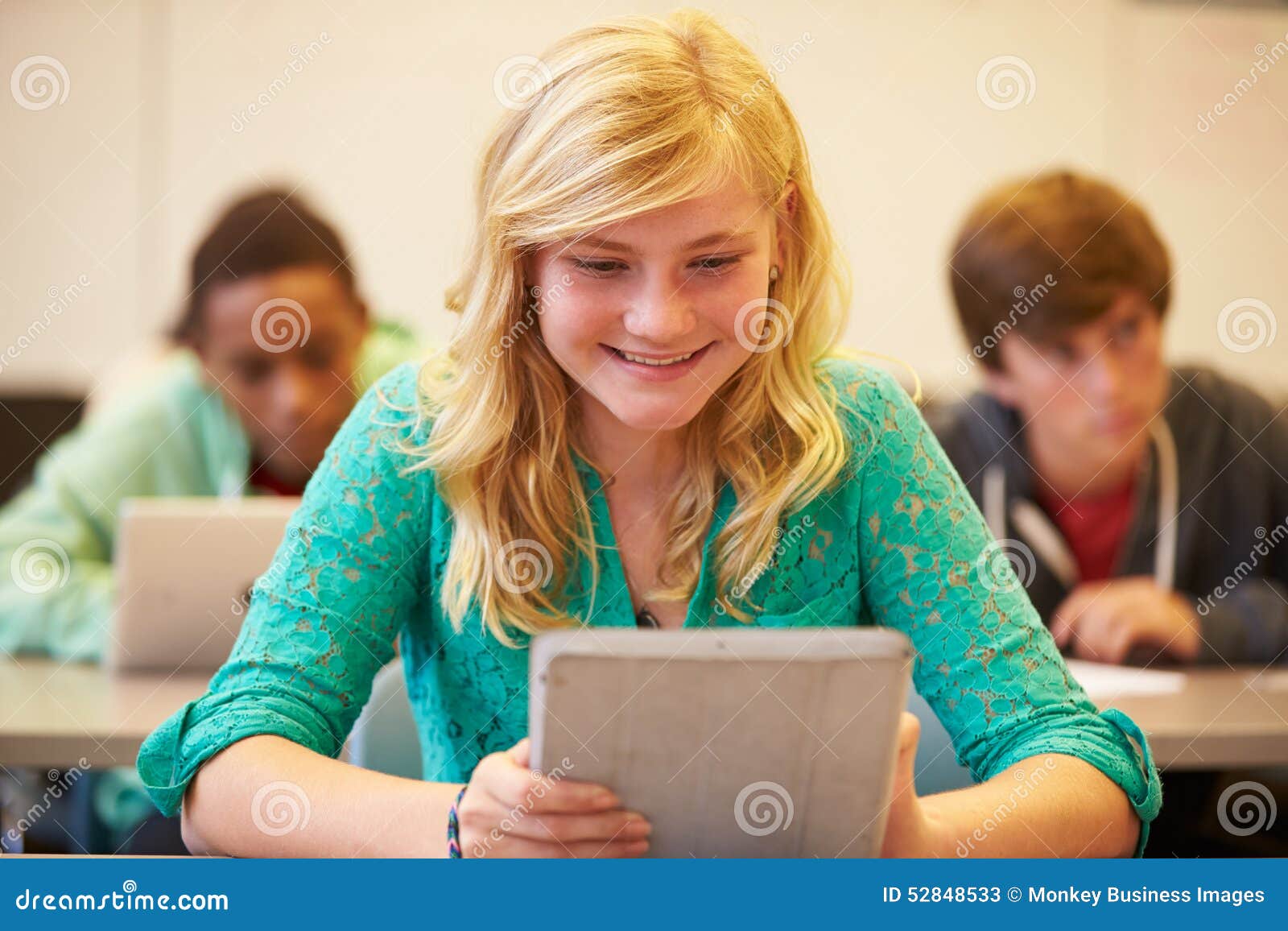 High School Student at Desk in Class Using Digital Tablet Stock Image ...
