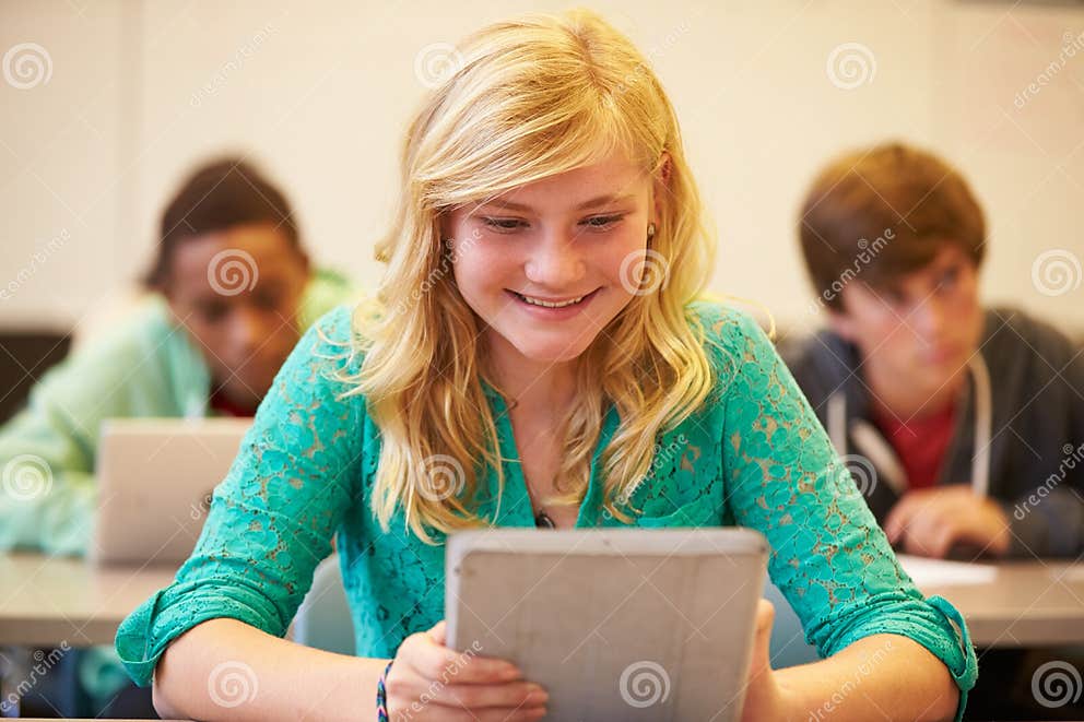 High School Student at Desk in Class Using Digital Tablet Stock Image ...