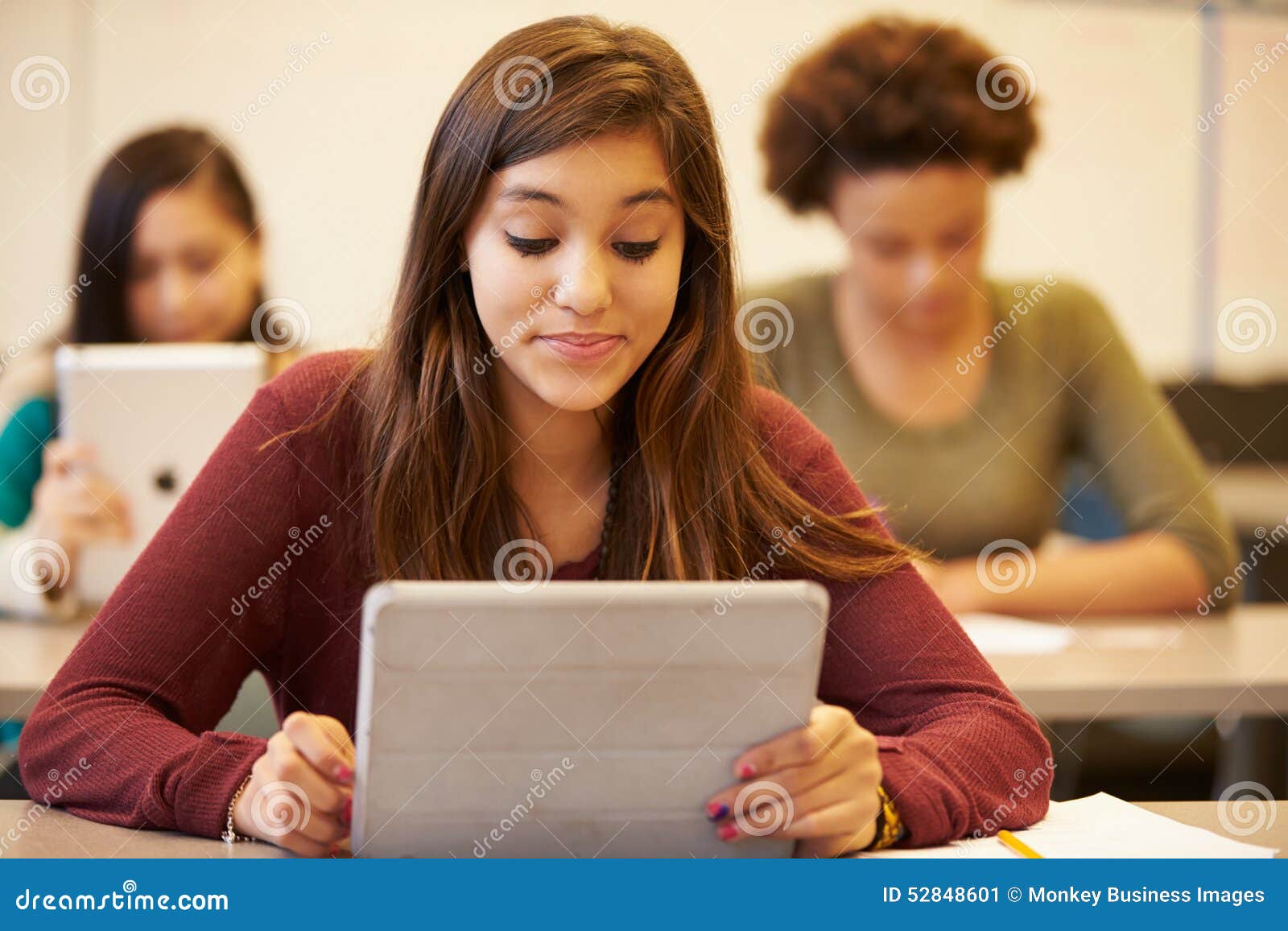 High School Student at Desk in Class Using Digital Tablet Stock Image ...