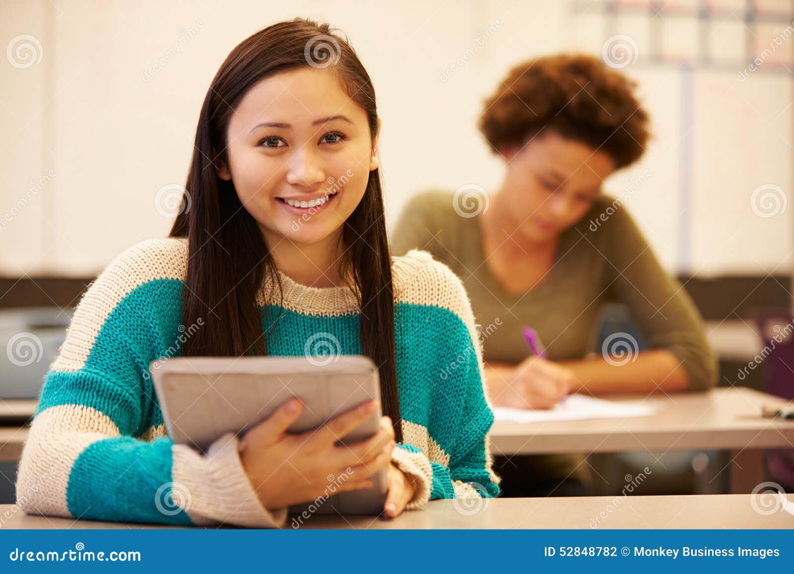 High School Student at Desk in Class Using Digital Tablet Stock Photo ...