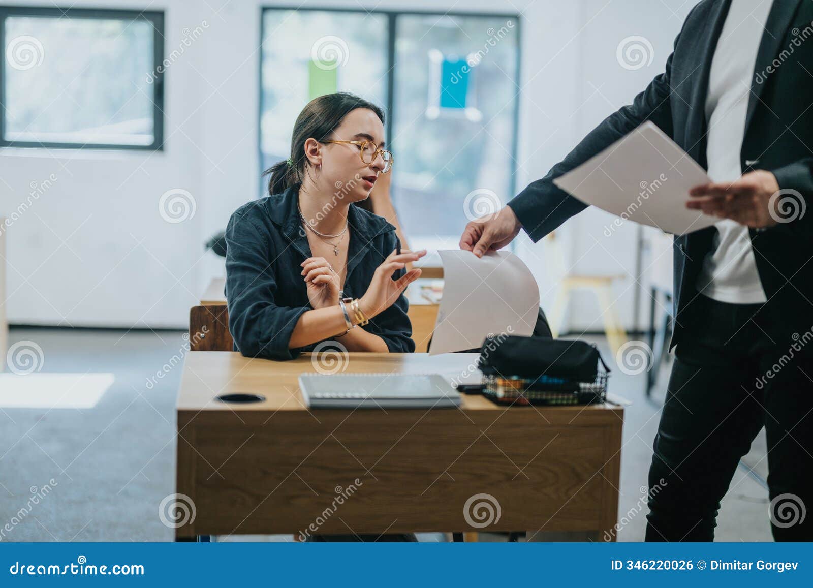 High School Student Engaging with Teacher during Class Discussion Stock ...