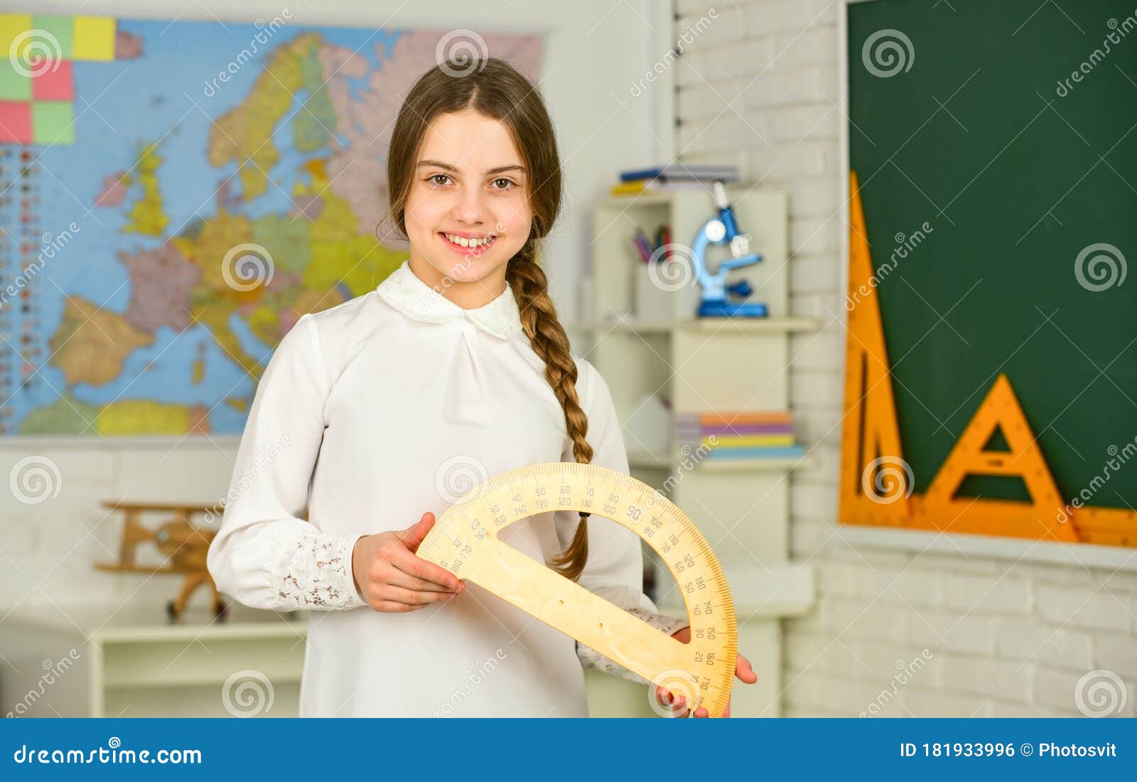 High School Student Learning Geometry in Class. Measure Angles in ...