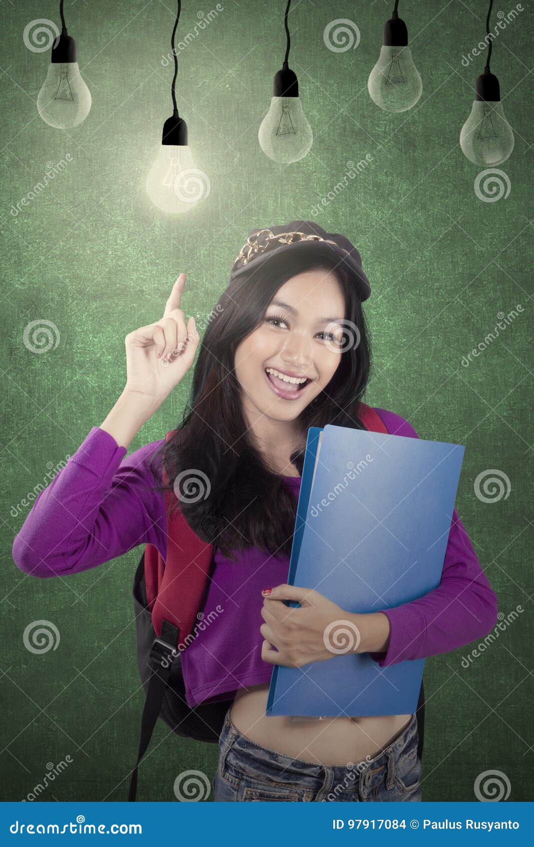 High School Student Pointing at a Light Bulb Stock Photo - Image of ...