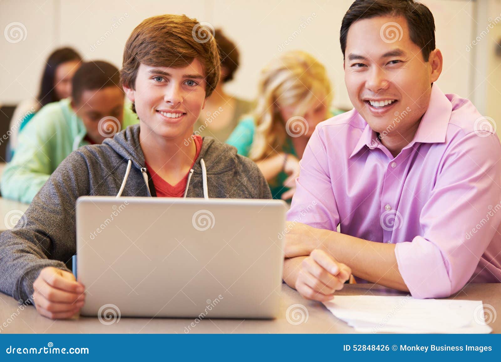 High School Student with Teacher in Class Using Laptop Stock Photo ...