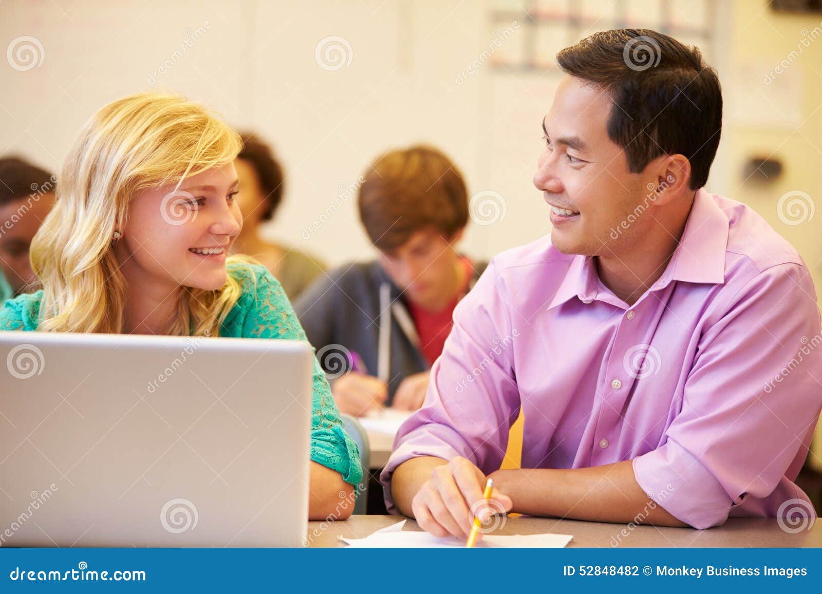 High School Student with Teacher in Class Using Laptop Stock Photo ...