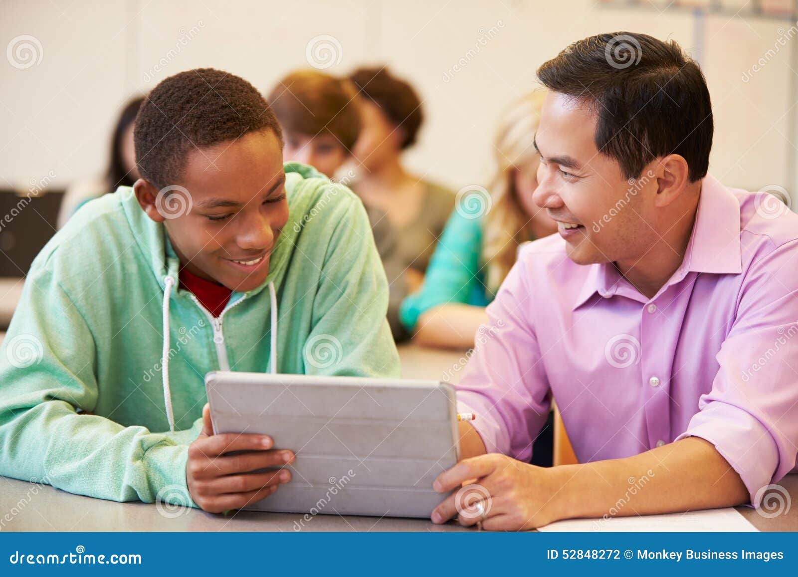 High School Student with Teacher Using Digital Tablet Stock Photo ...