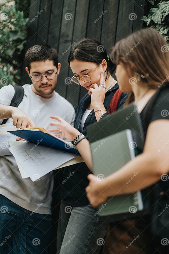 High School Students Collaborating on Homework Assignments Outdoors ...