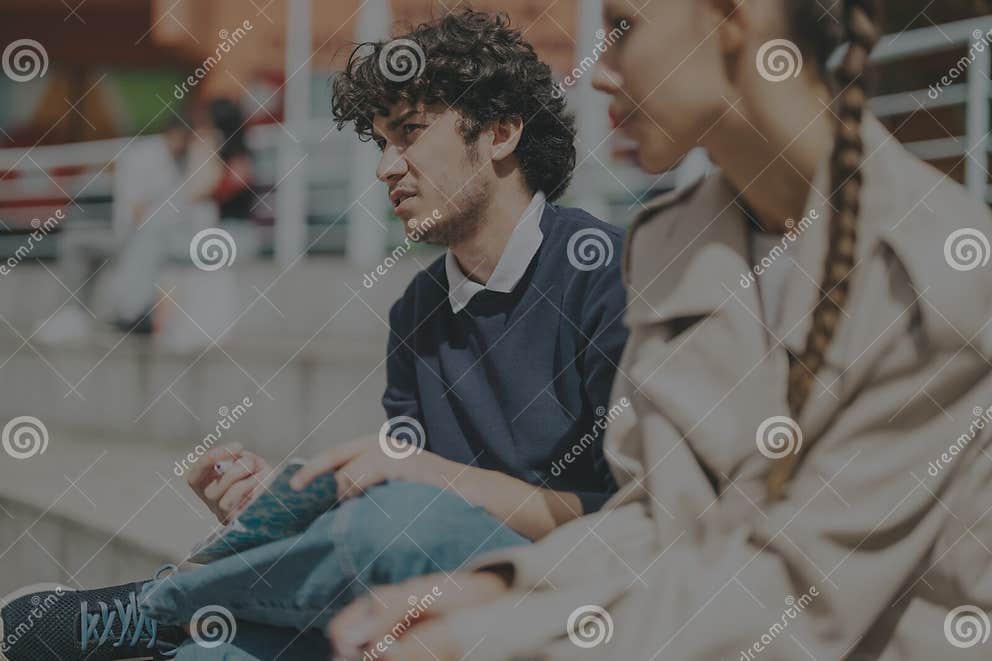 High School Students Collaborating with Professor Outdoors on Tasks ...