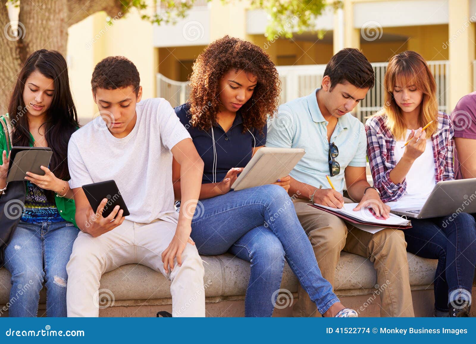 High School Students Collaborating on Project on Campus Stock Photo ...