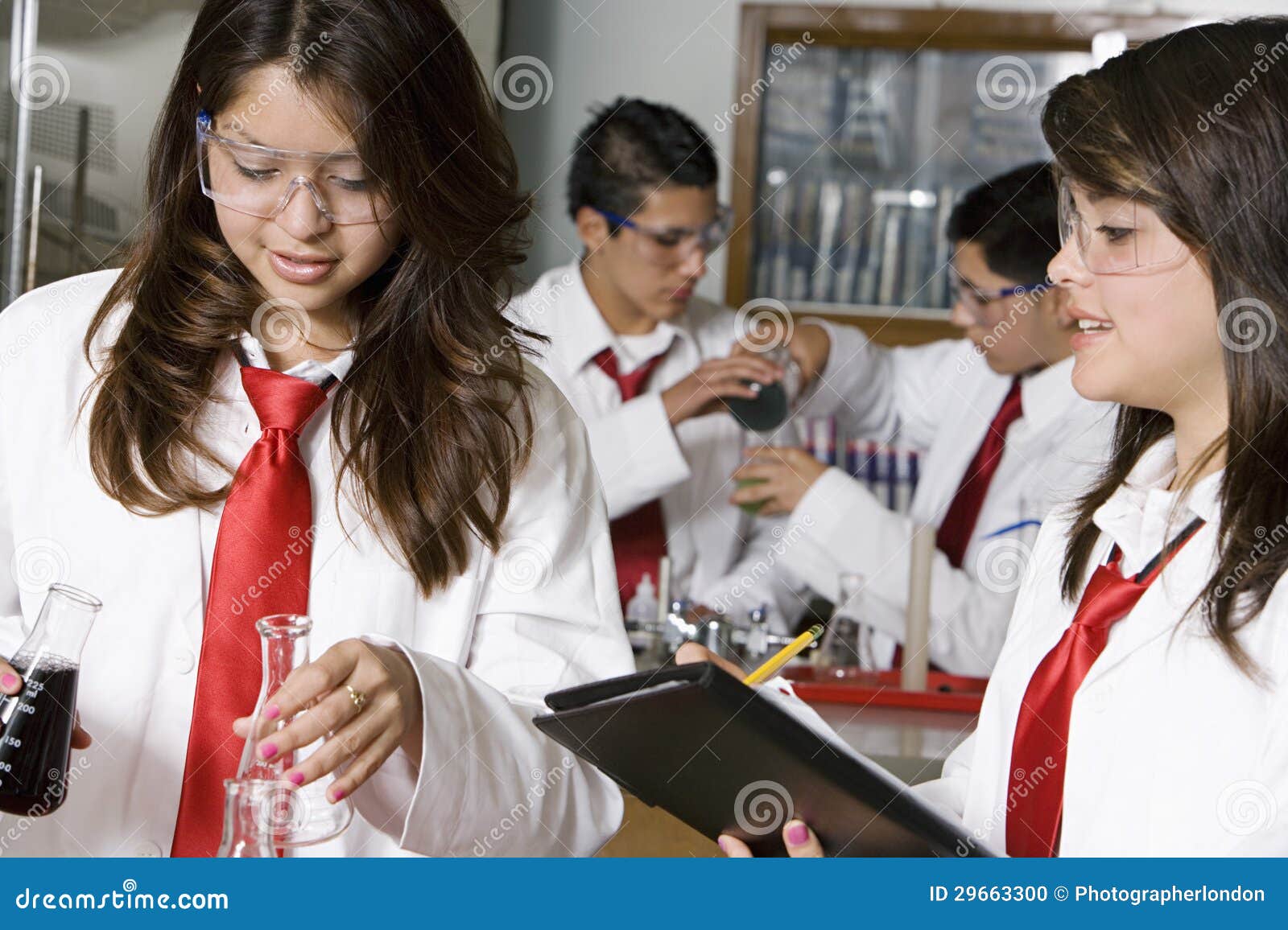 High School Students Conducting Experiment Stock Photo - Image of ...
