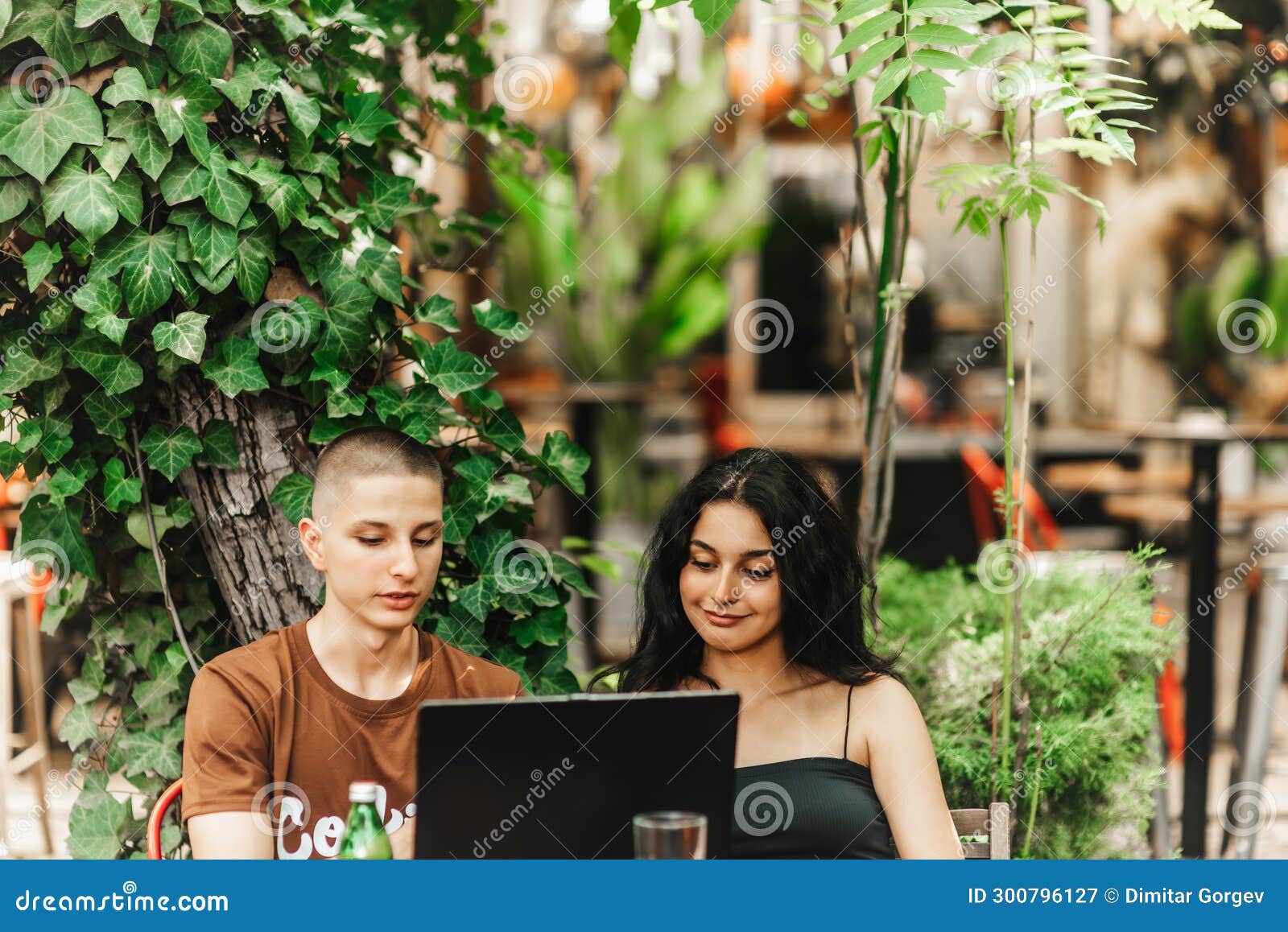 High School Students Gather at a Cafe after Classes, Discussing and ...