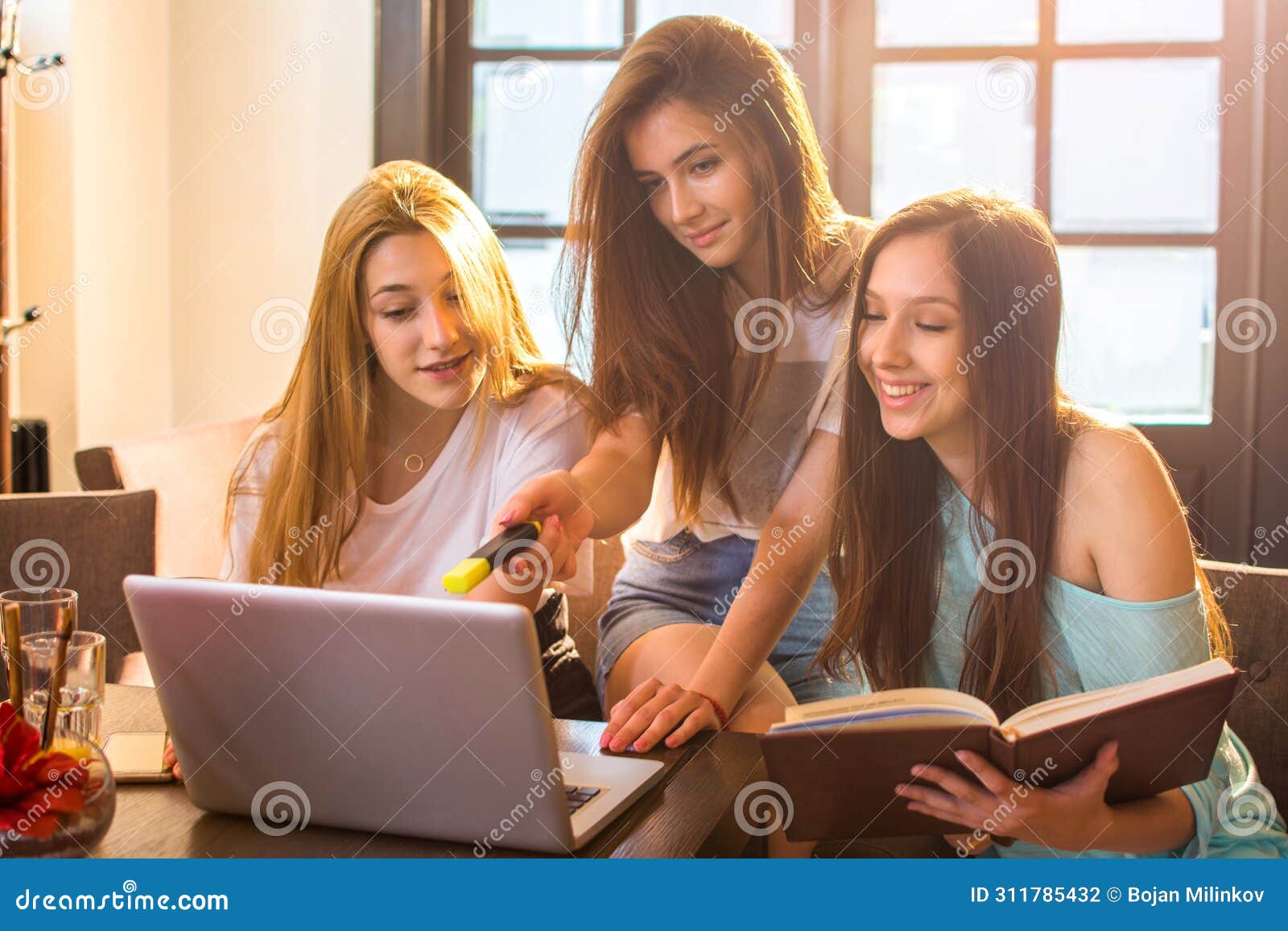 High School Students Learning with Laptop and Books Together. Stock ...