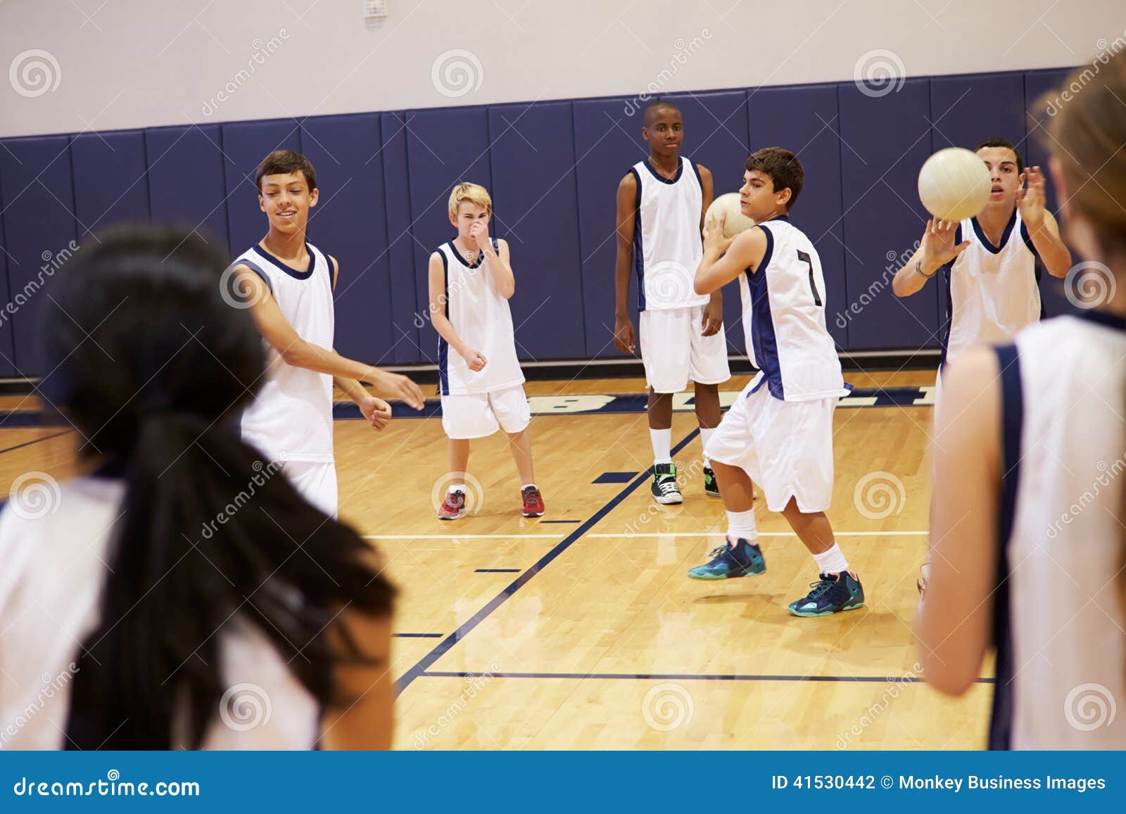 High School Students Playing Dodge Ball in Gym Stock Photo - Image of ...