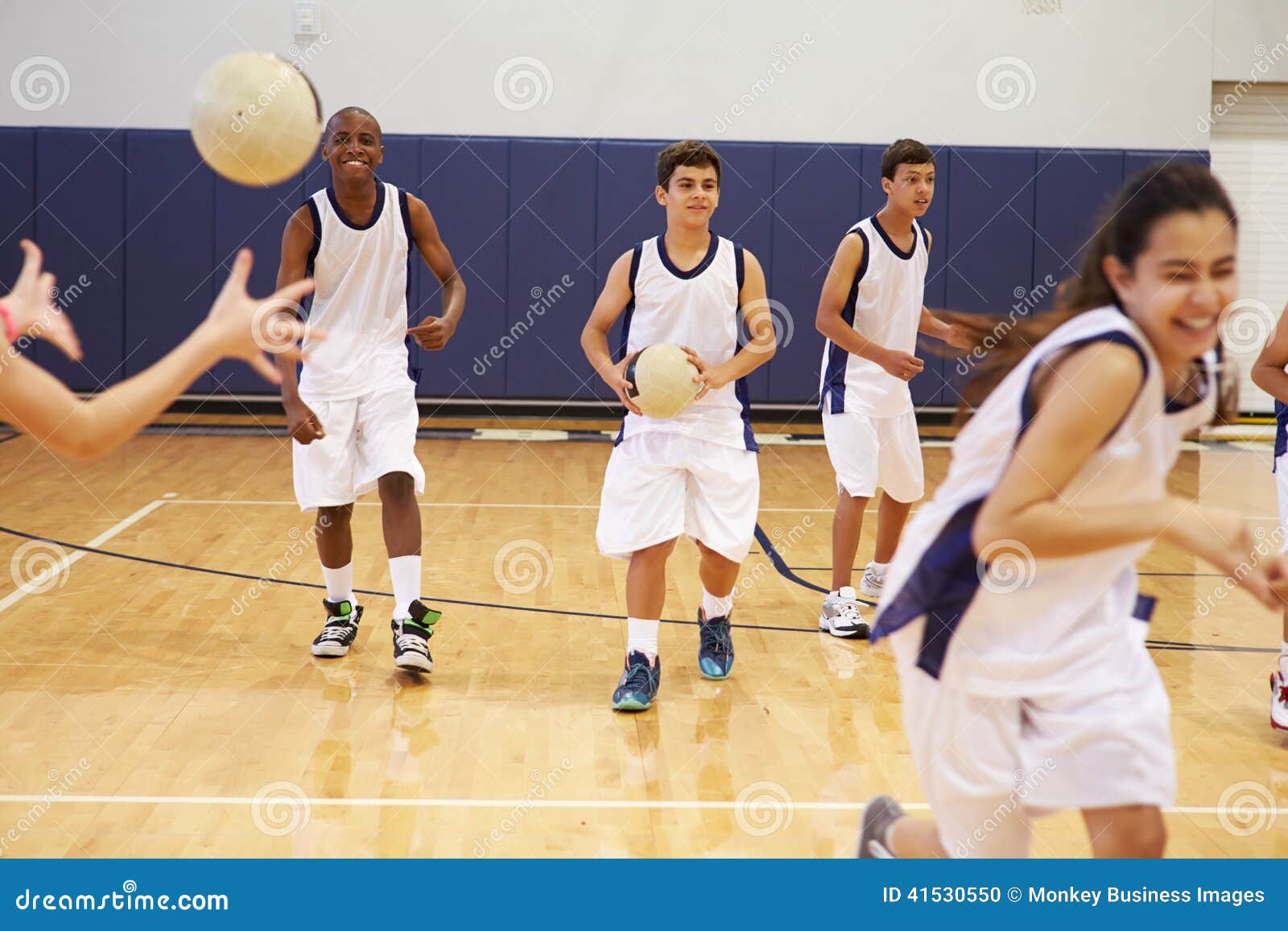 High School Students Playing Dodge Ball in Gym Stock Photo - Image of ...