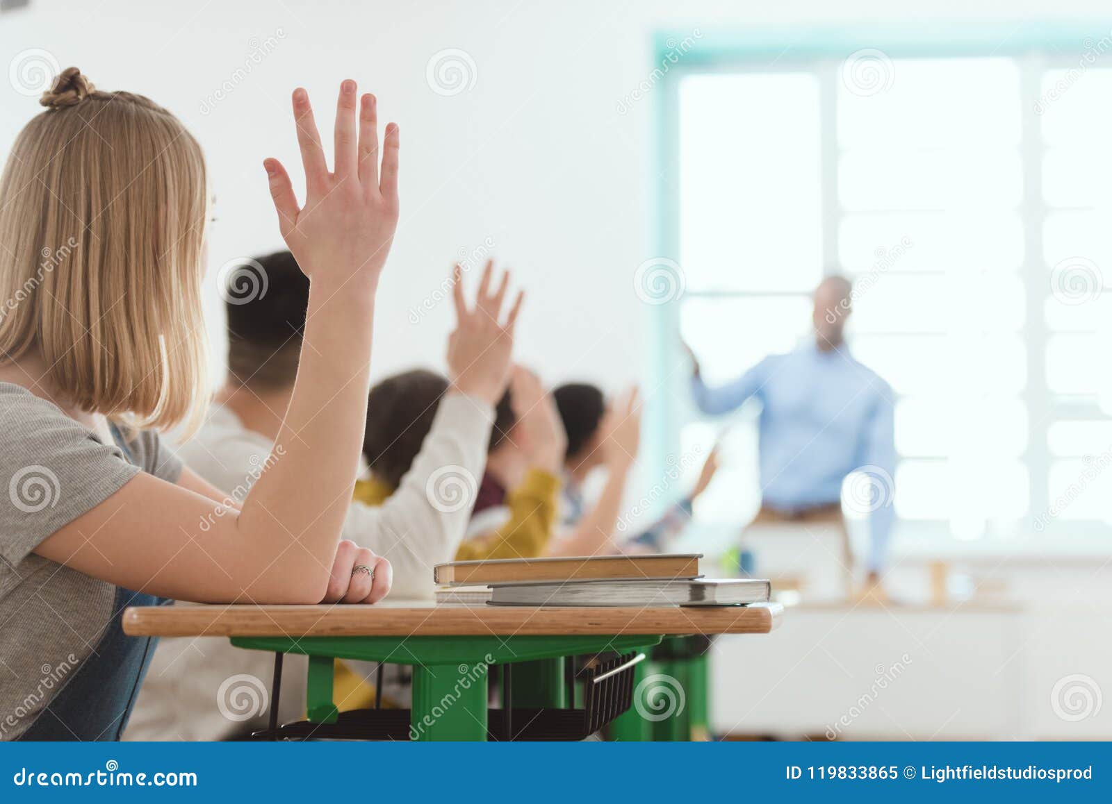 High School Students Raising Hands To Answer Stock Image - Image of ...