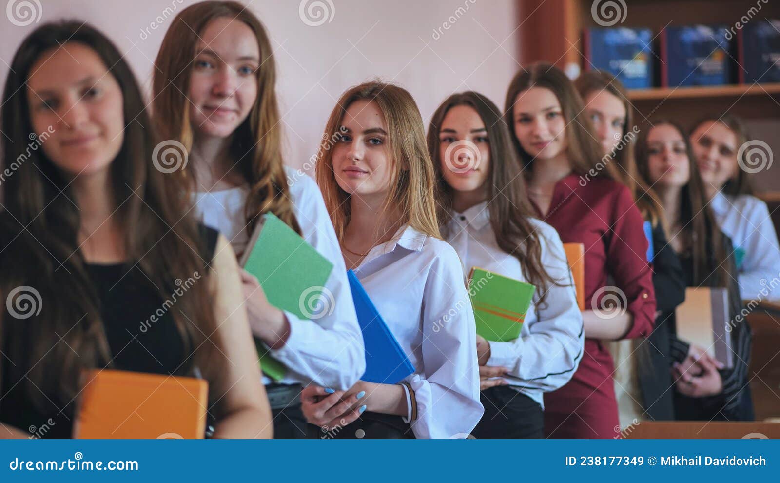 High School Students are in a Row in the Classroom with Textbooks ...