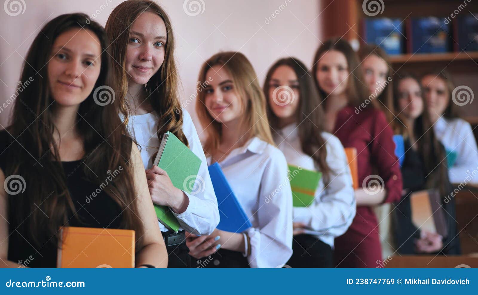 High School Students are in a Row in the Classroom with Textbooks ...