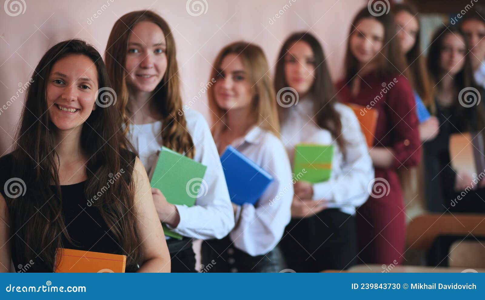 High School Students are in a Row in the Classroom with Textbooks ...