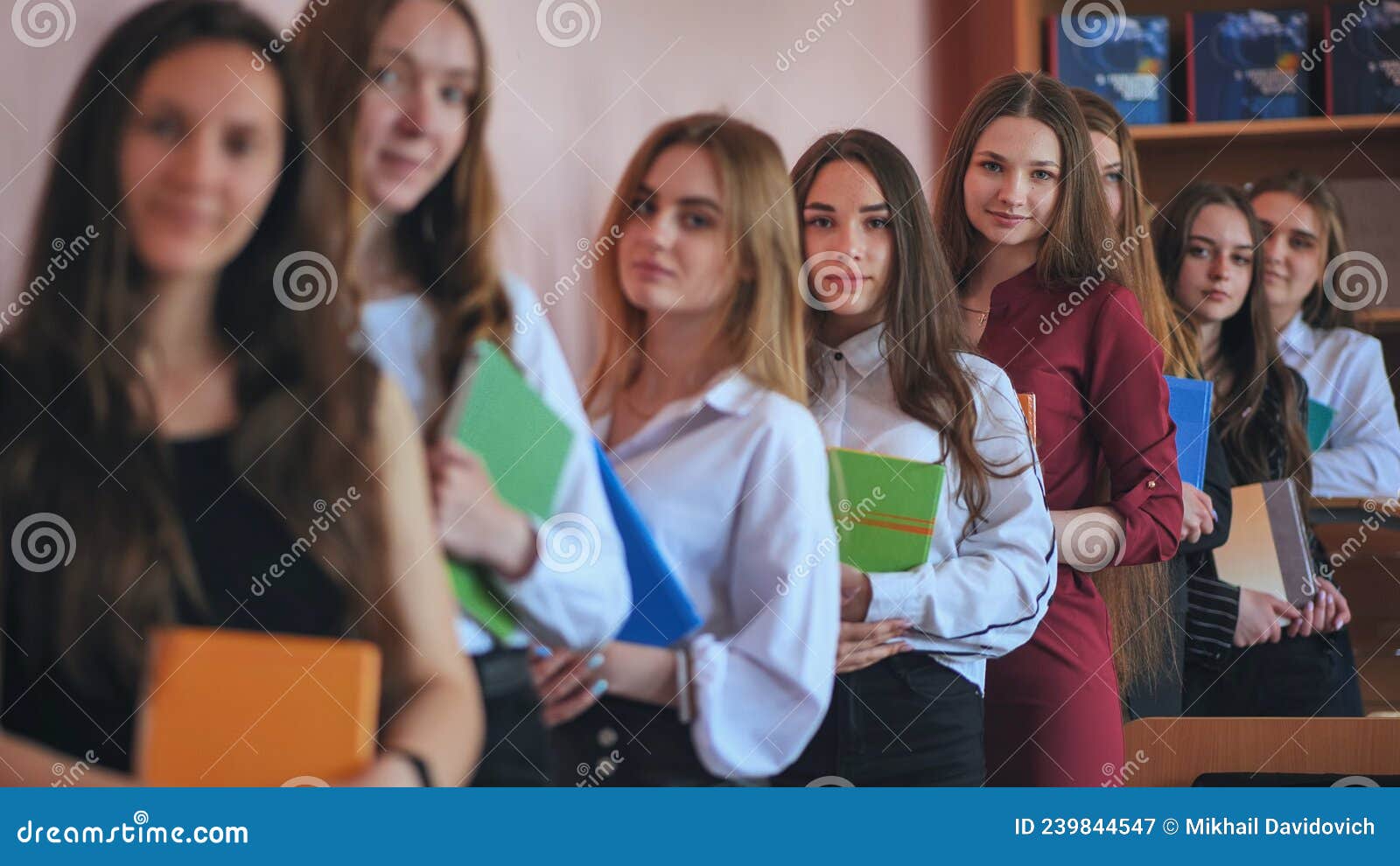 High School Students are in a Row in the Classroom with Textbooks ...