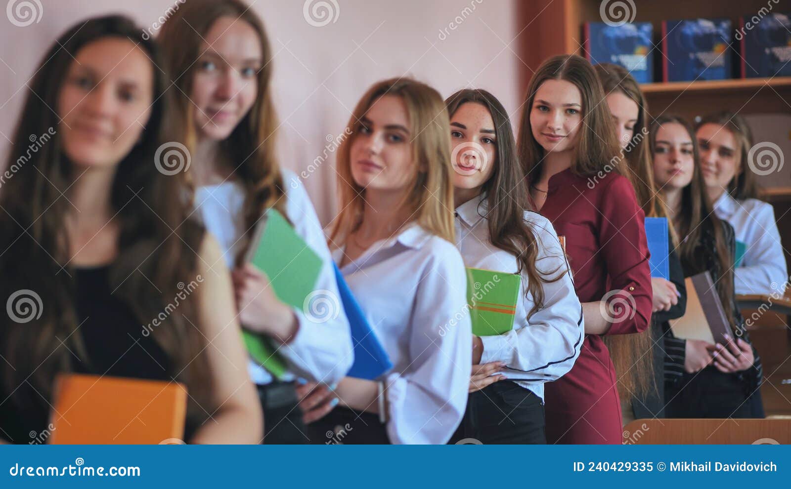 High School Students are in a Row in the Classroom with Textbooks ...