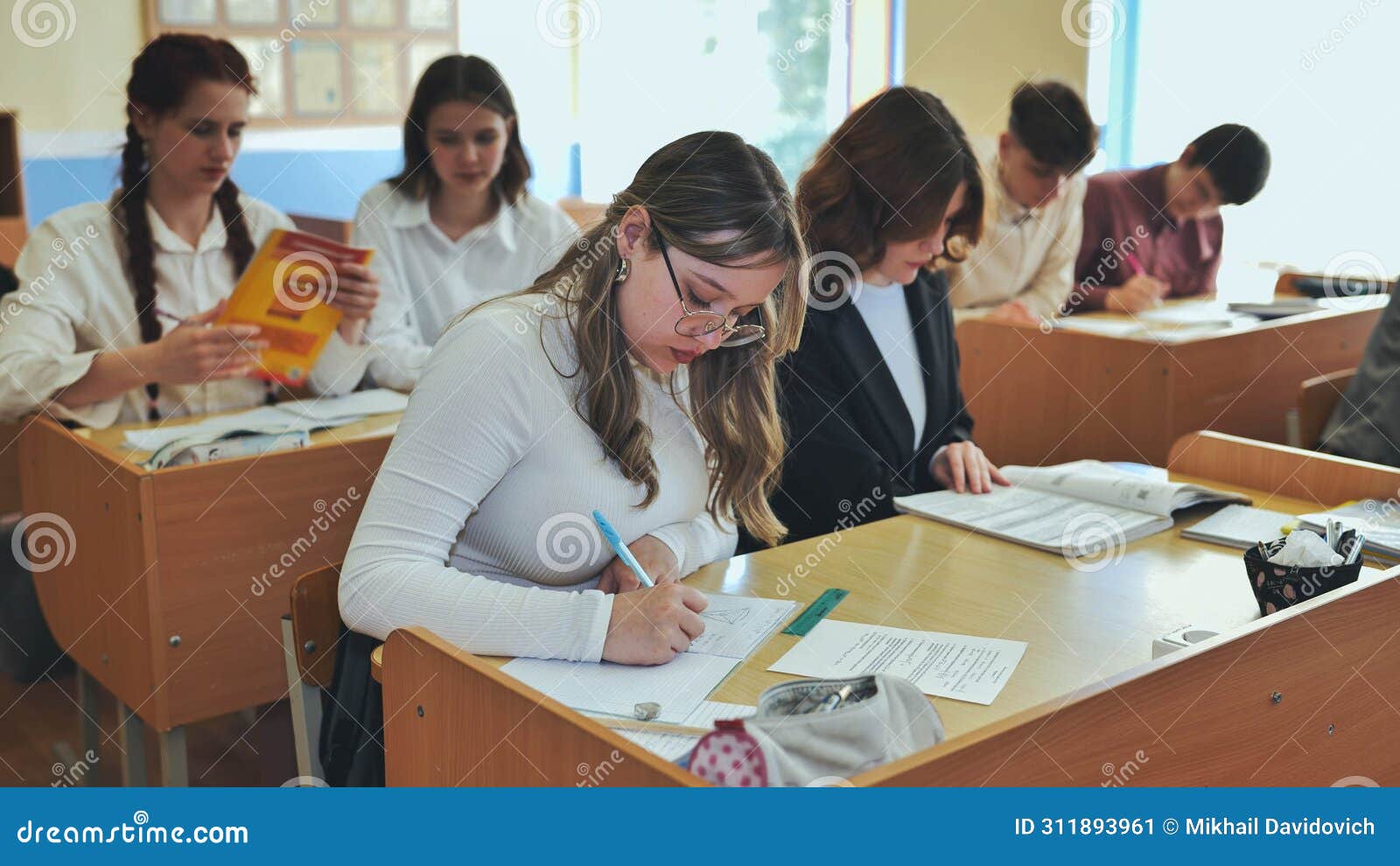 High School Students Sitting at a Desk. Stock Image - Image of people ...