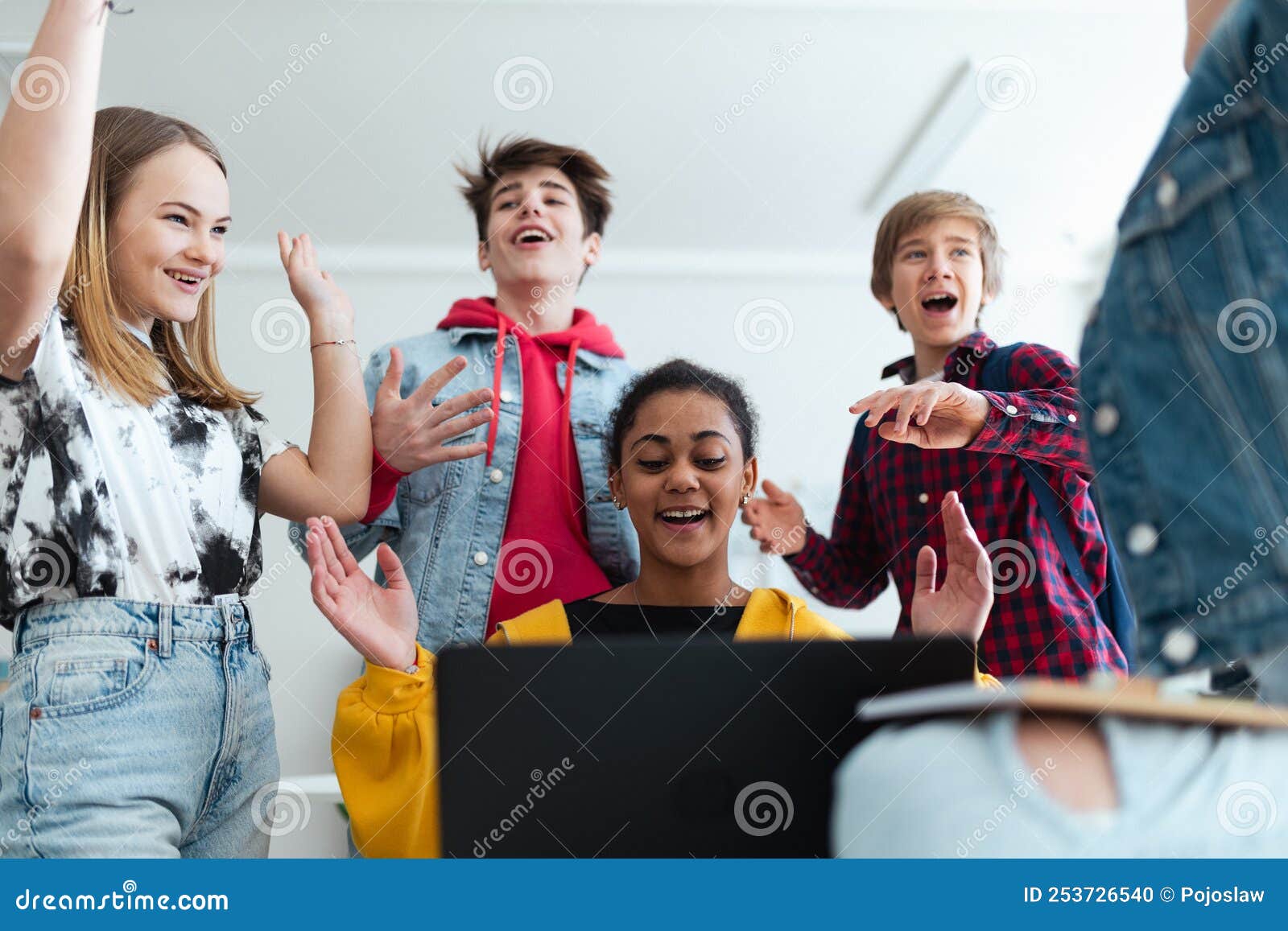 High School Students Sitting Together at Desk and Using Laptop and ...