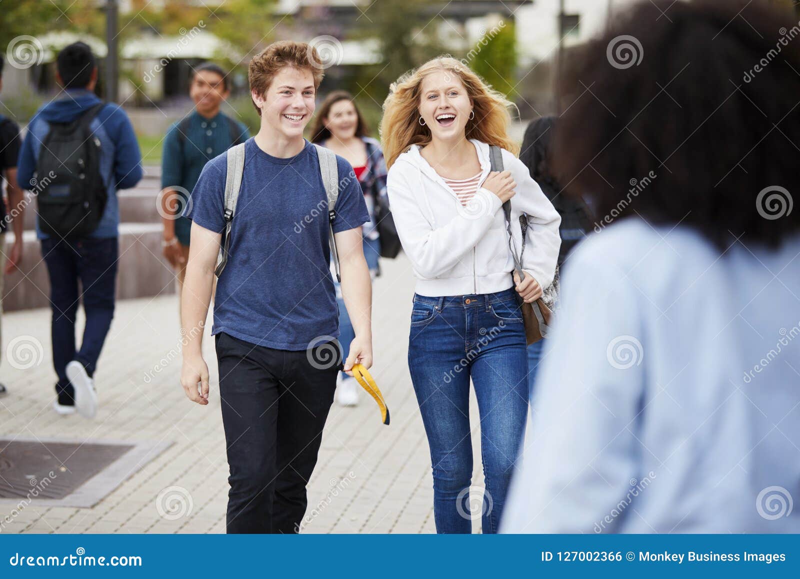 High School Students Socializing Outside College Buildings Stock Photo ...