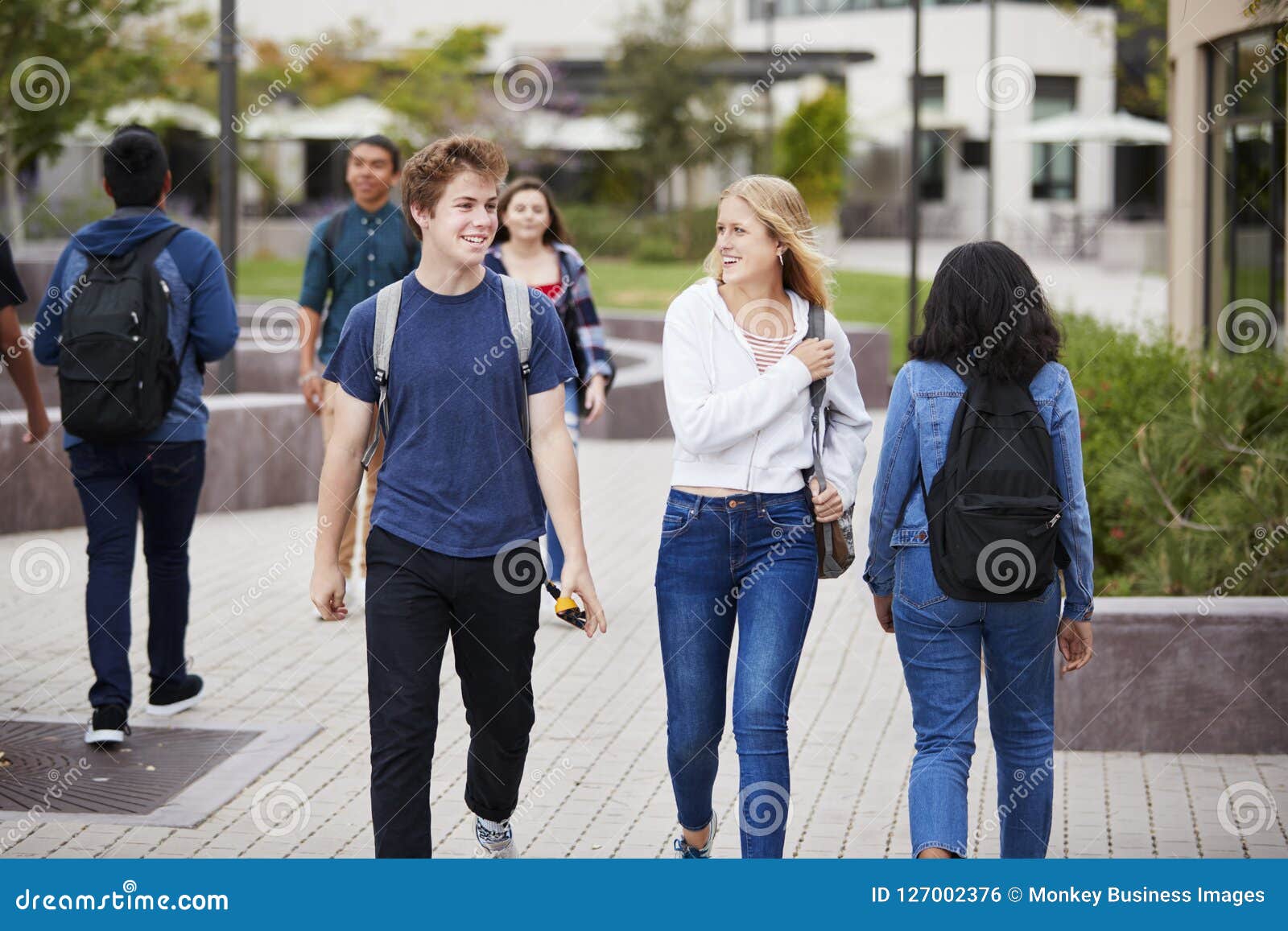 High School Students Socializing Outside College Buildings Stock Photo ...