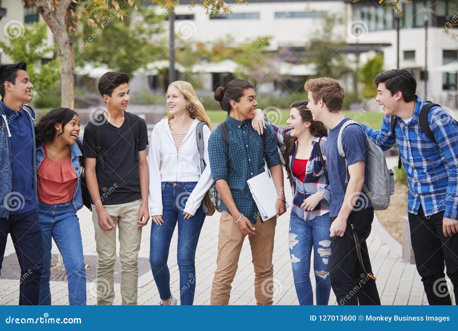 High School Students Socializing Outside College Buildings Stock Photo ...