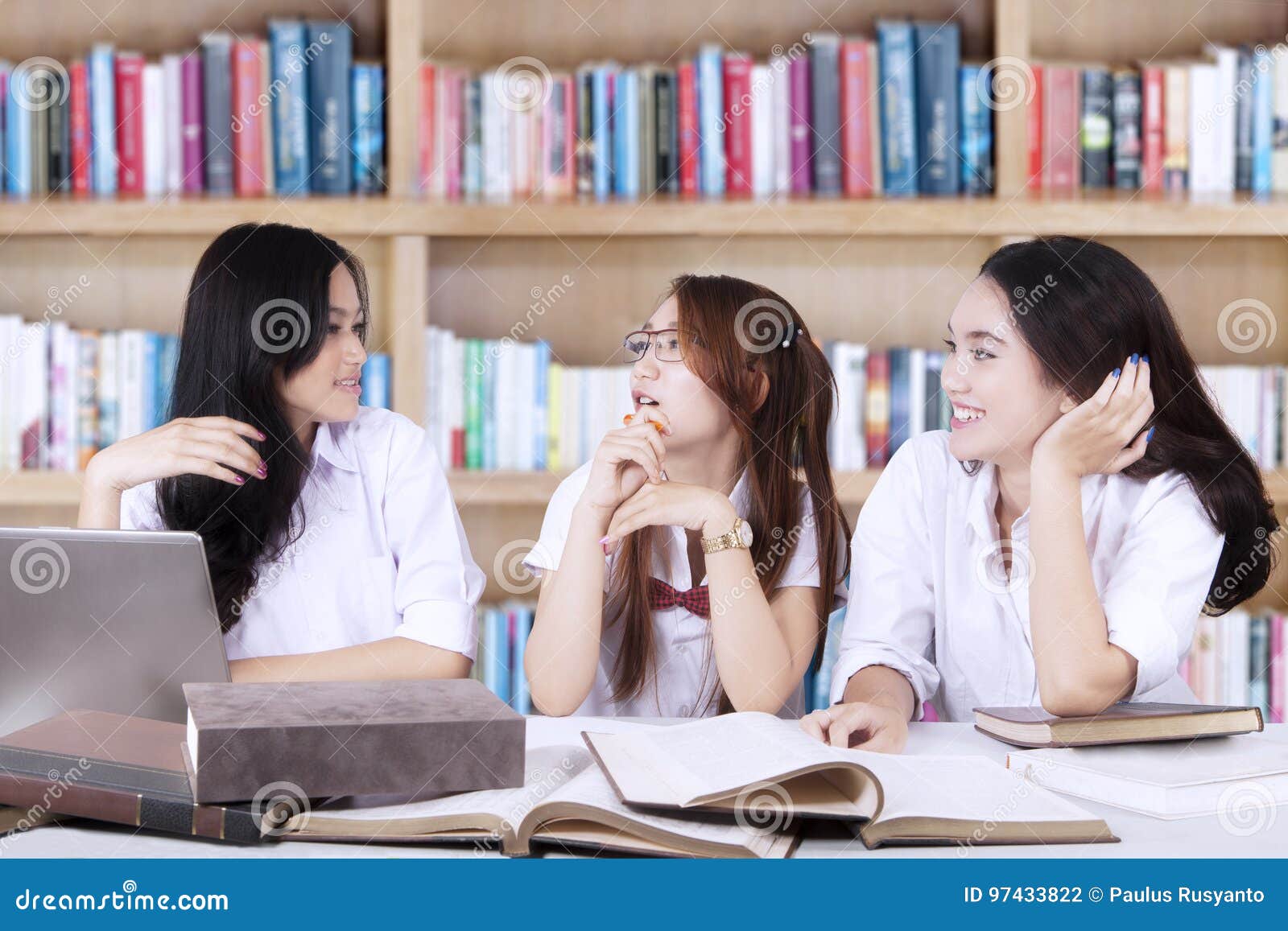 High School Students Talking in Library Stock Photo - Image of brunette ...