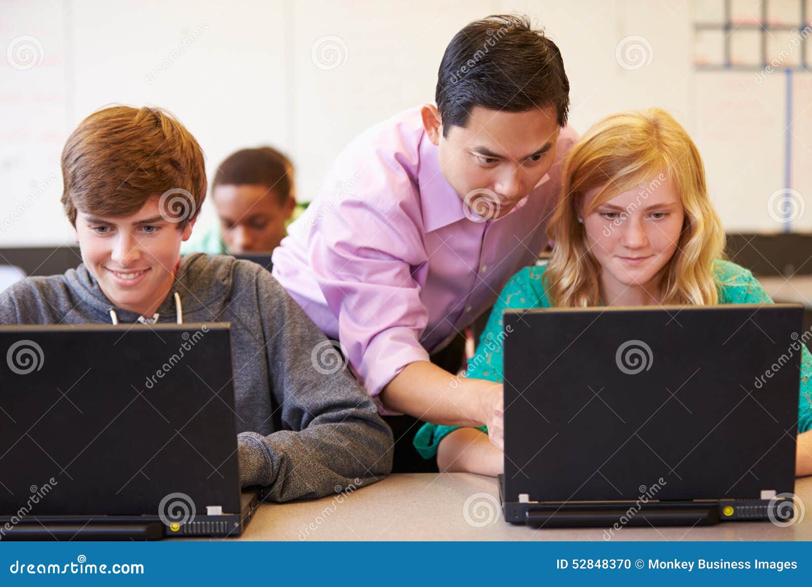 High School Students with Teacher in Class Using Laptops Stock Photo ...