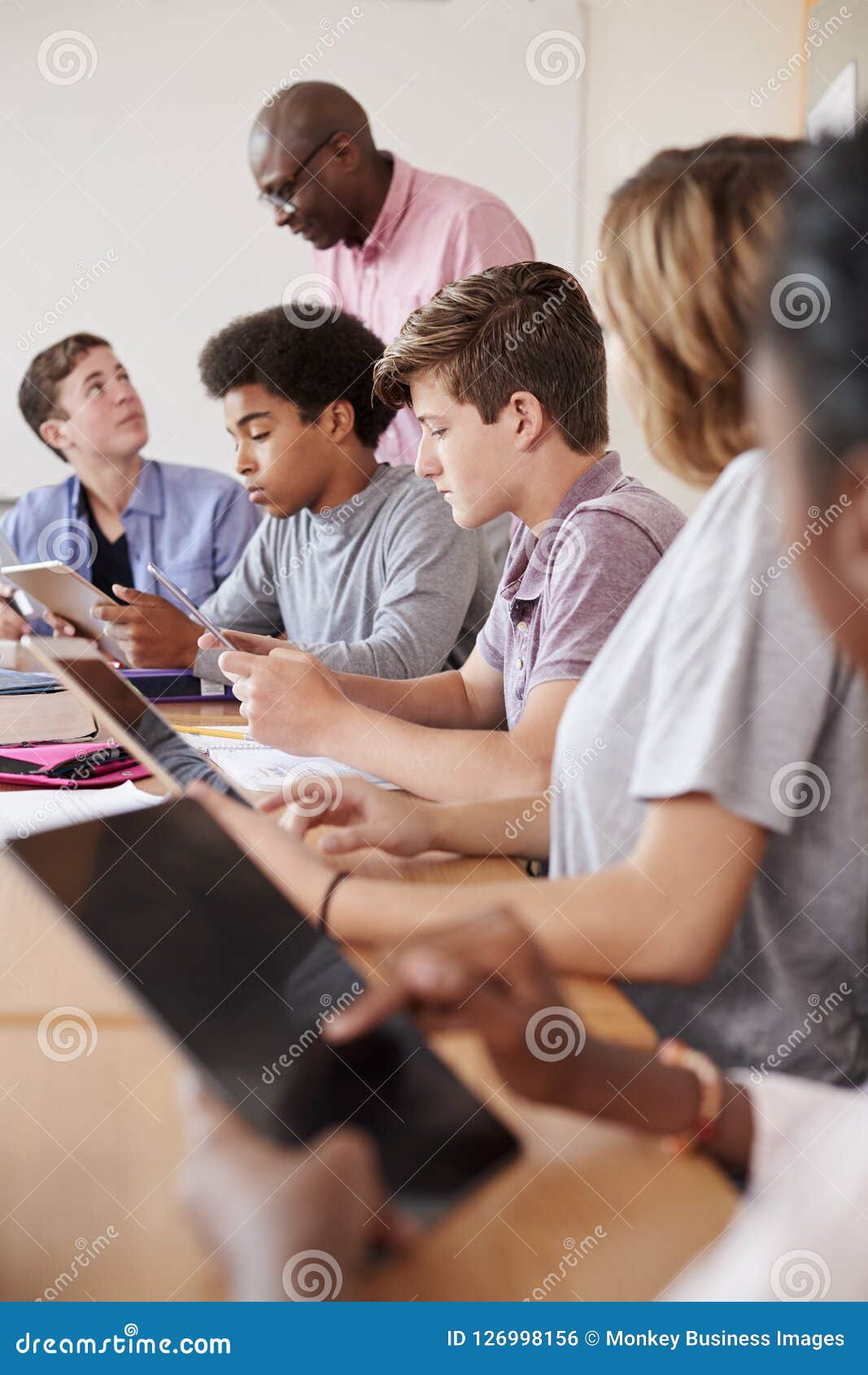 High School Teacher with Pupils Using Digital Tablets in Technology ...