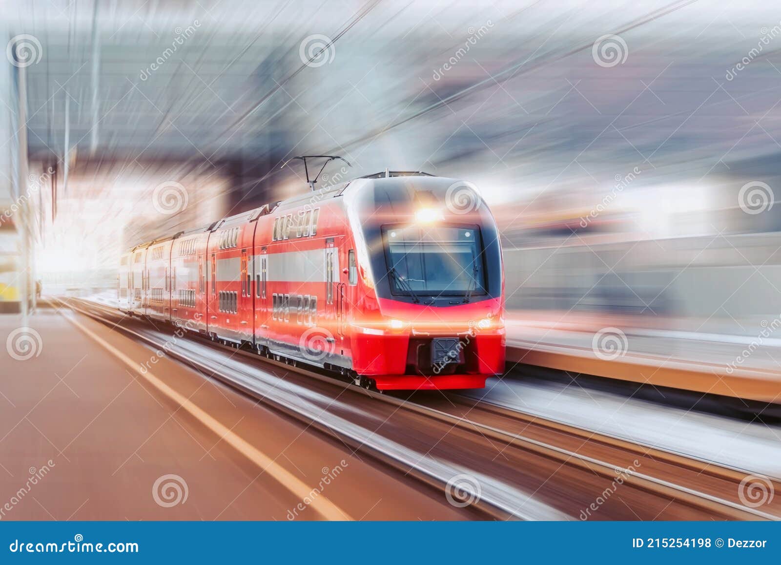 High Speed Double Decker Express Train Arrives at a Station in the City ...