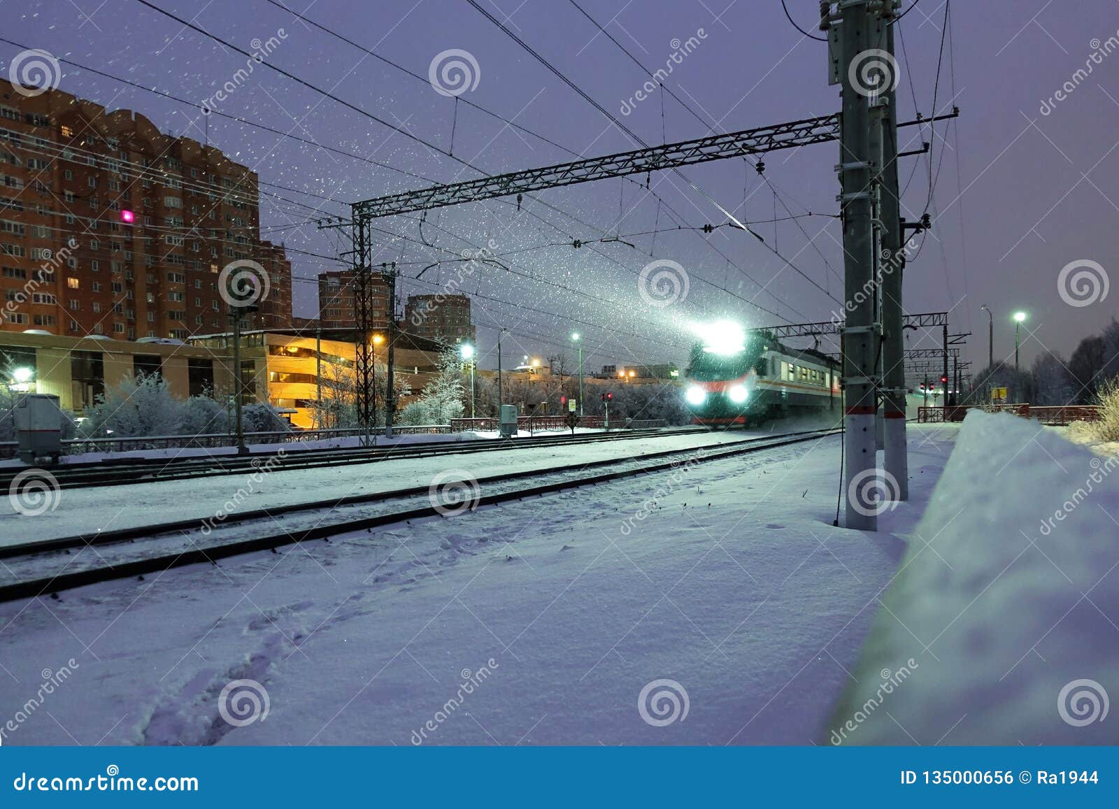 High-speed Passenger Electric Train at Night. a Beam of Train Spotlight ...