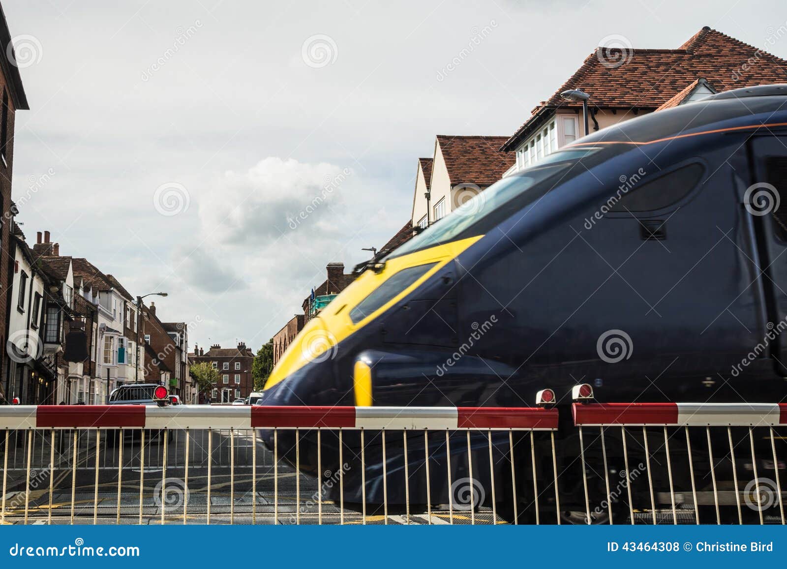 High Speed Train at Level Crossing Stock Photo - Image of level, house ...