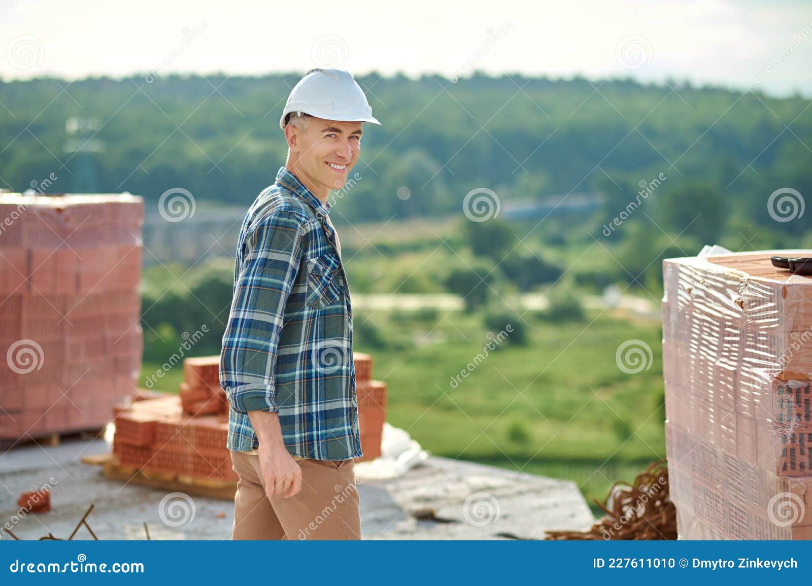 High-spirited Middle-aged Worker Standing among the Construction ...