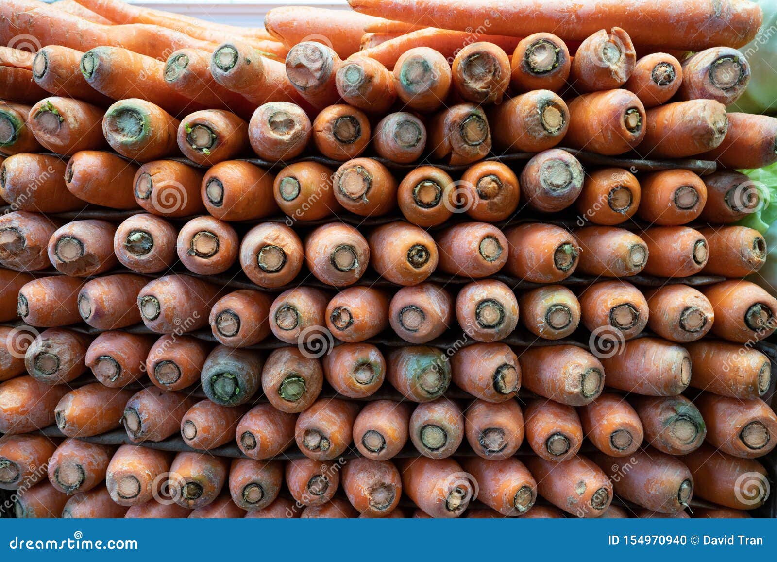 High Stack of Carrot Facing End Side on Shelf in Grocery Store Stock ...