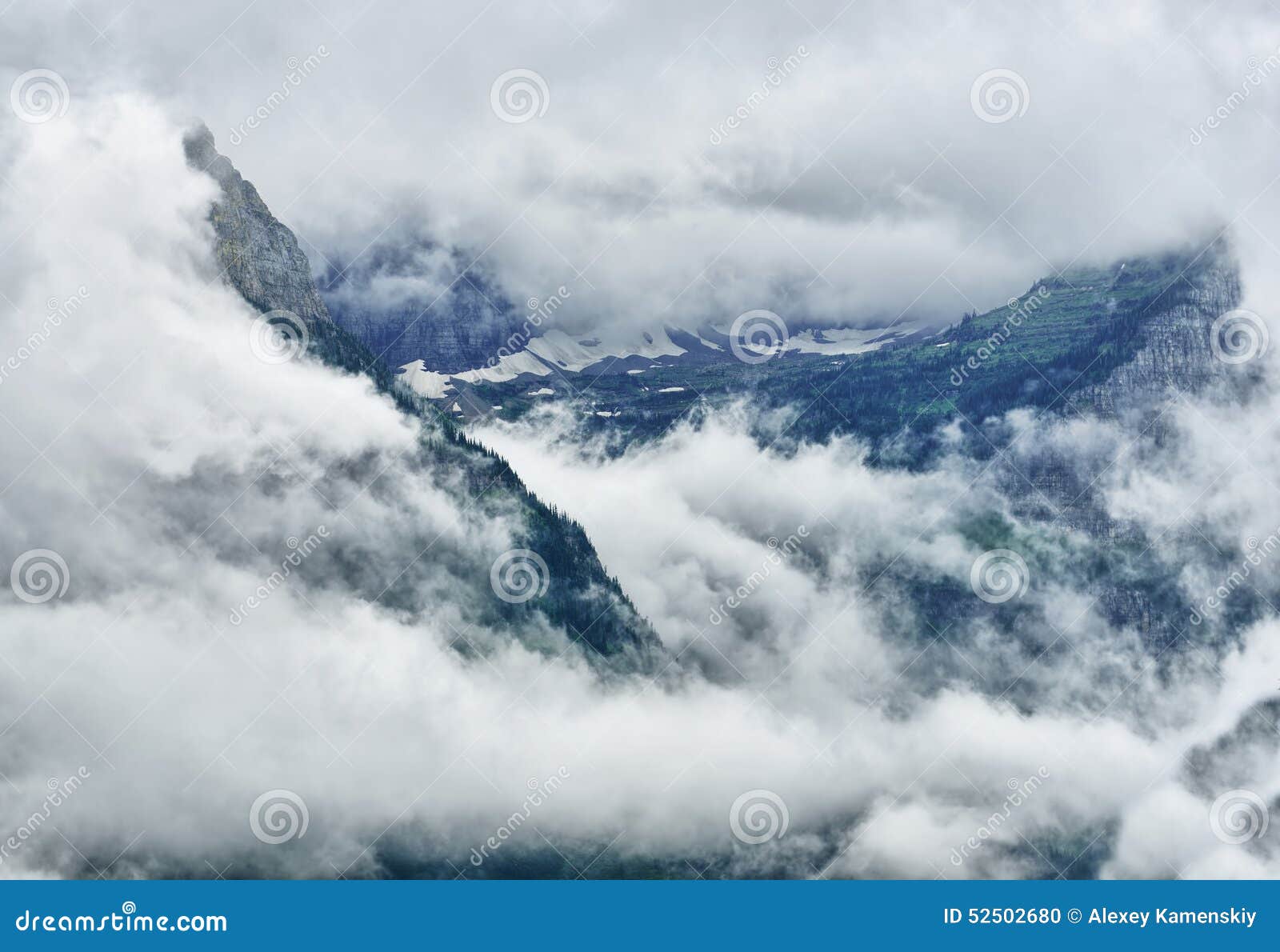 High and Steep Mountain Surrounded by Heavy Clouds Stock Photo - Image ...