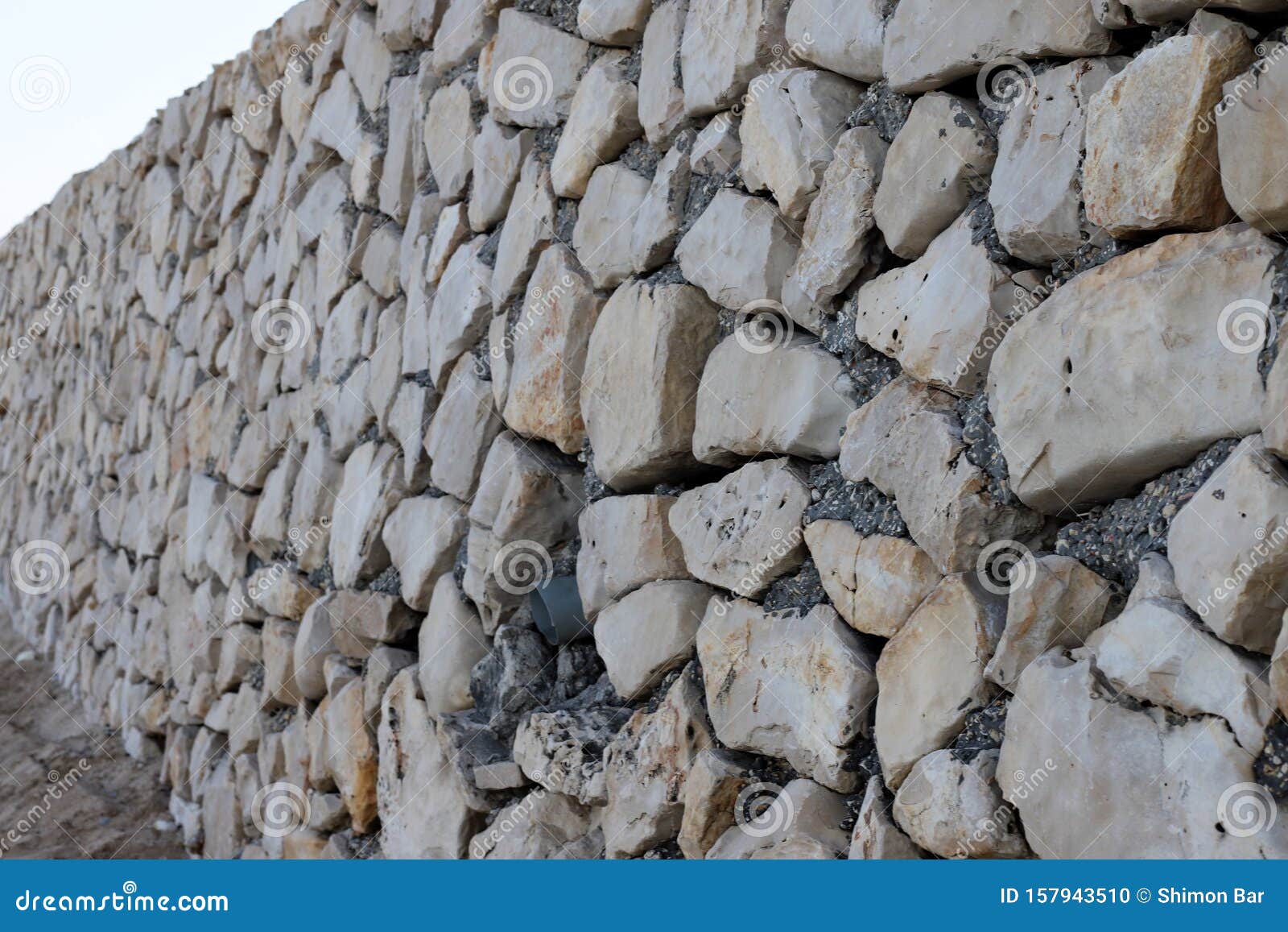 High Stone and Concrete Wall Stock Photo - Image of concrete, morning ...