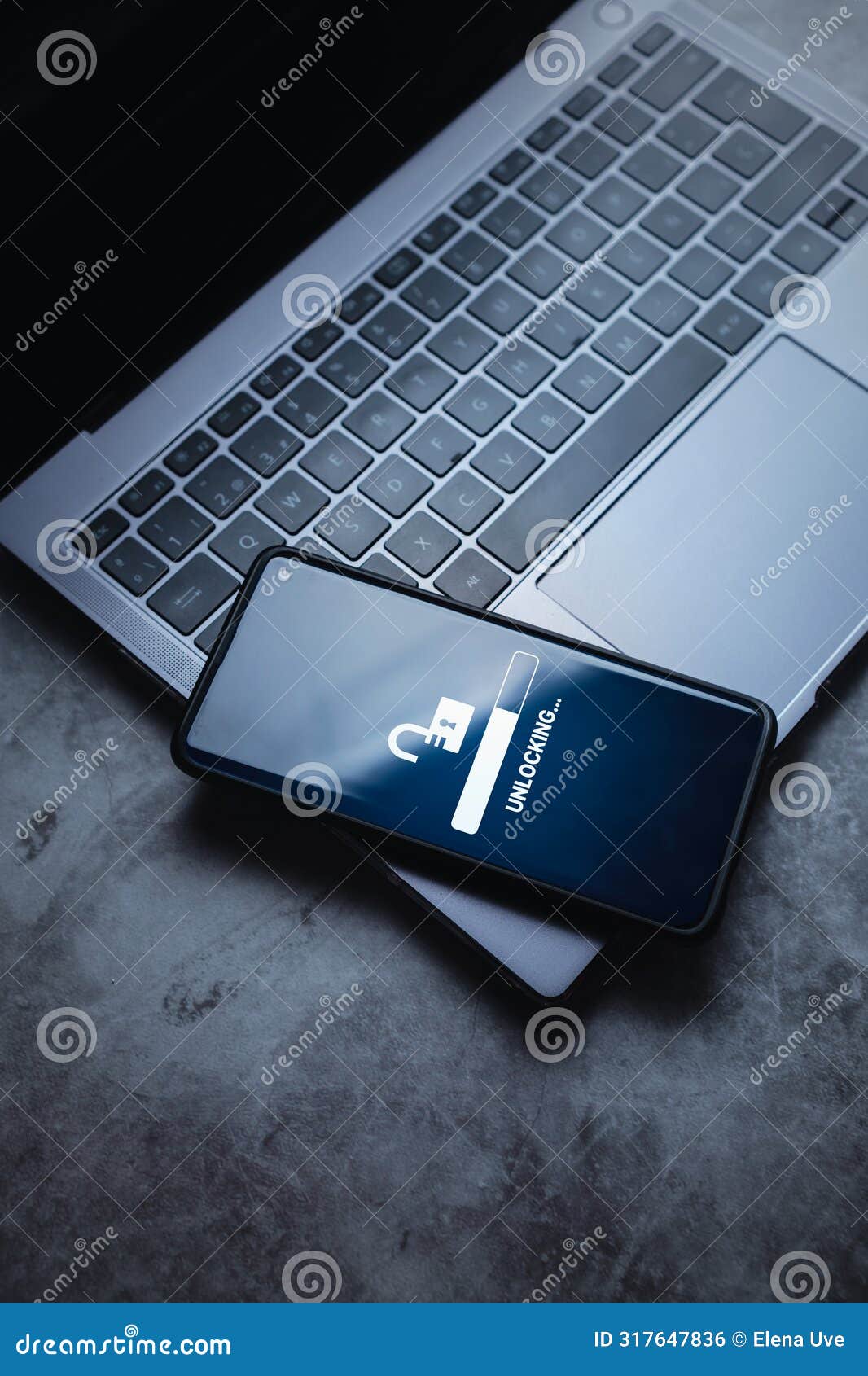 High View of Smartphone Laying on Laptop with Unlocking Process on ...
