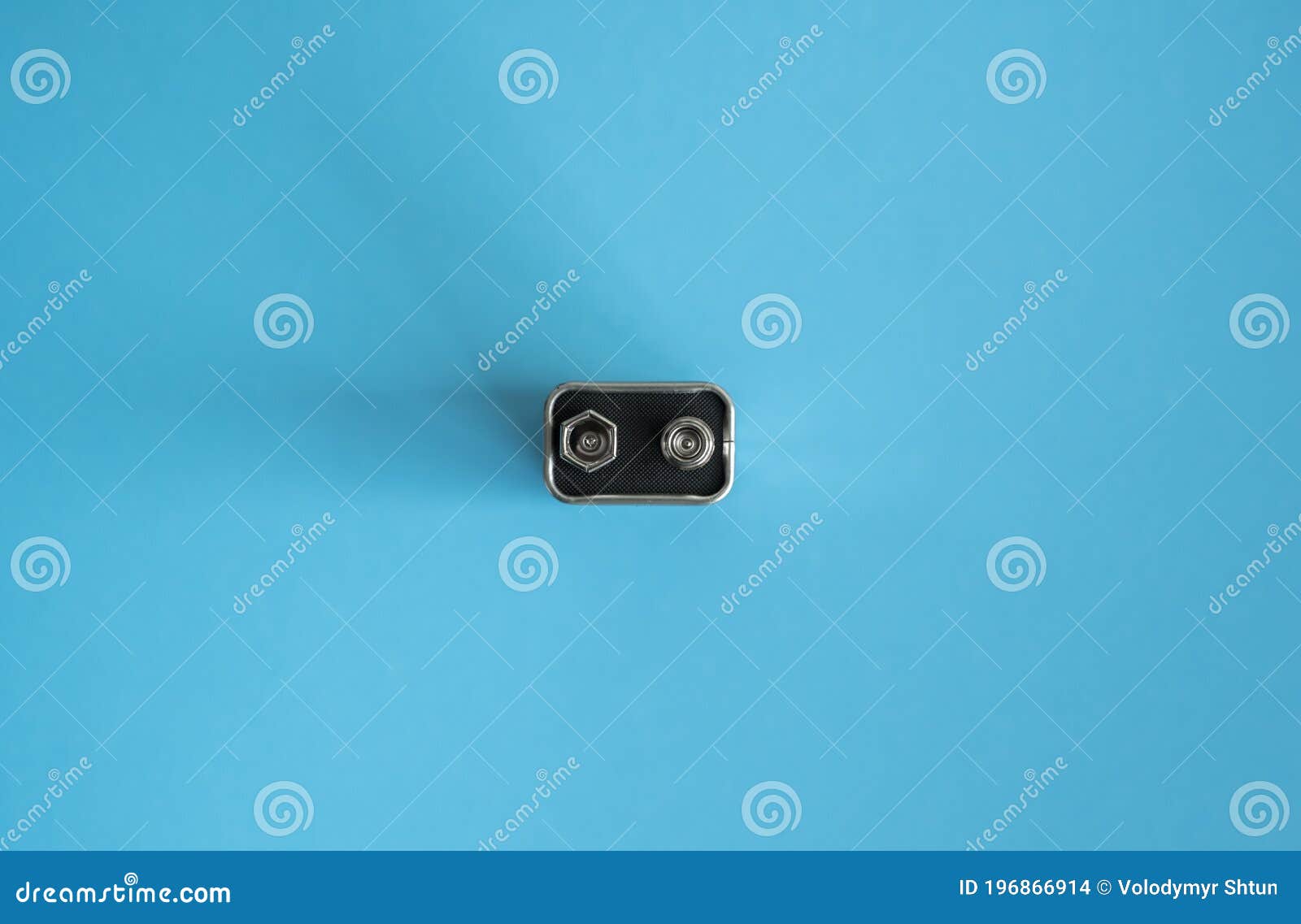 High Voltage Battery On A Blue Background. Silver Volt Battery. 9V ...