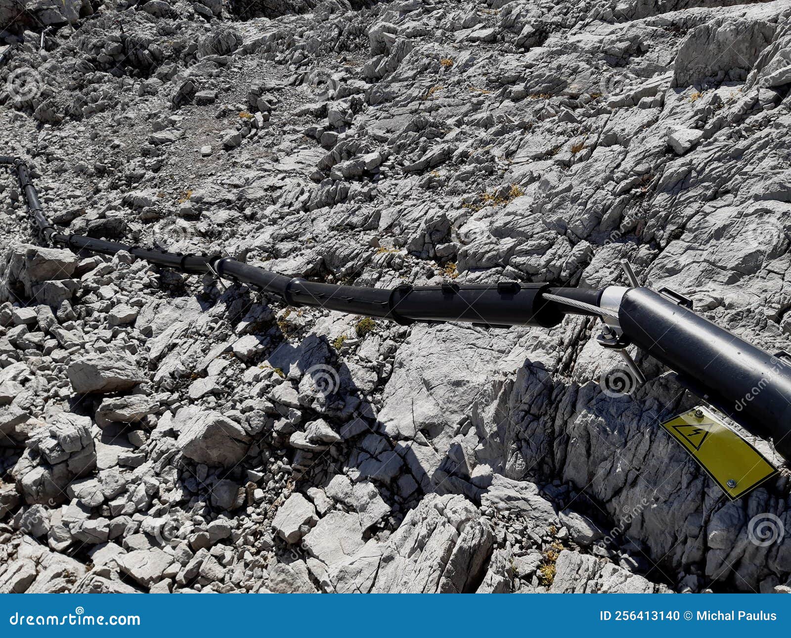 The High Voltage Cable is Attached To the Limestone Rock Using Stock ...