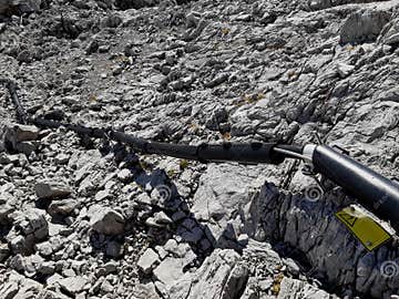 The High Voltage Cable is Attached To the Limestone Rock Using Stock ...