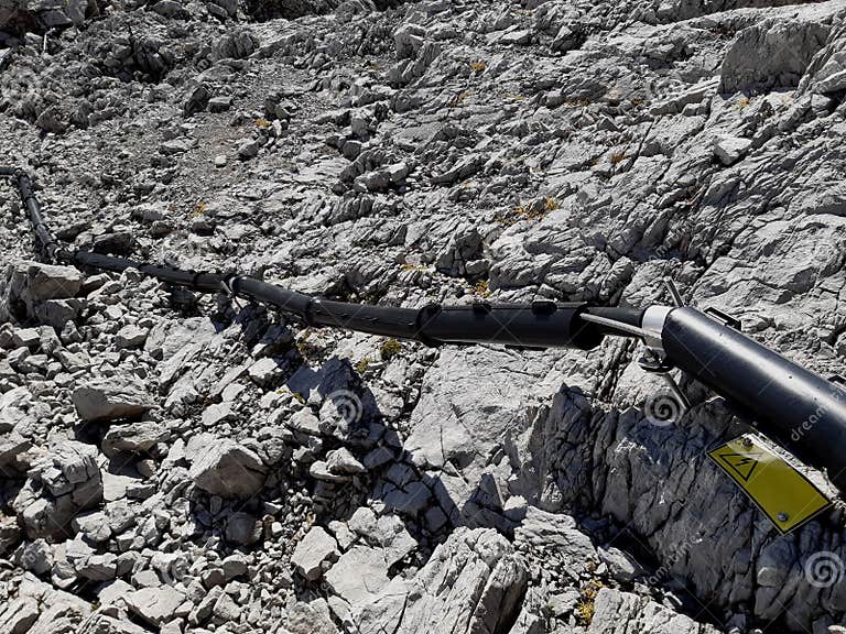 The High Voltage Cable is Attached To the Limestone Rock Using Stock ...