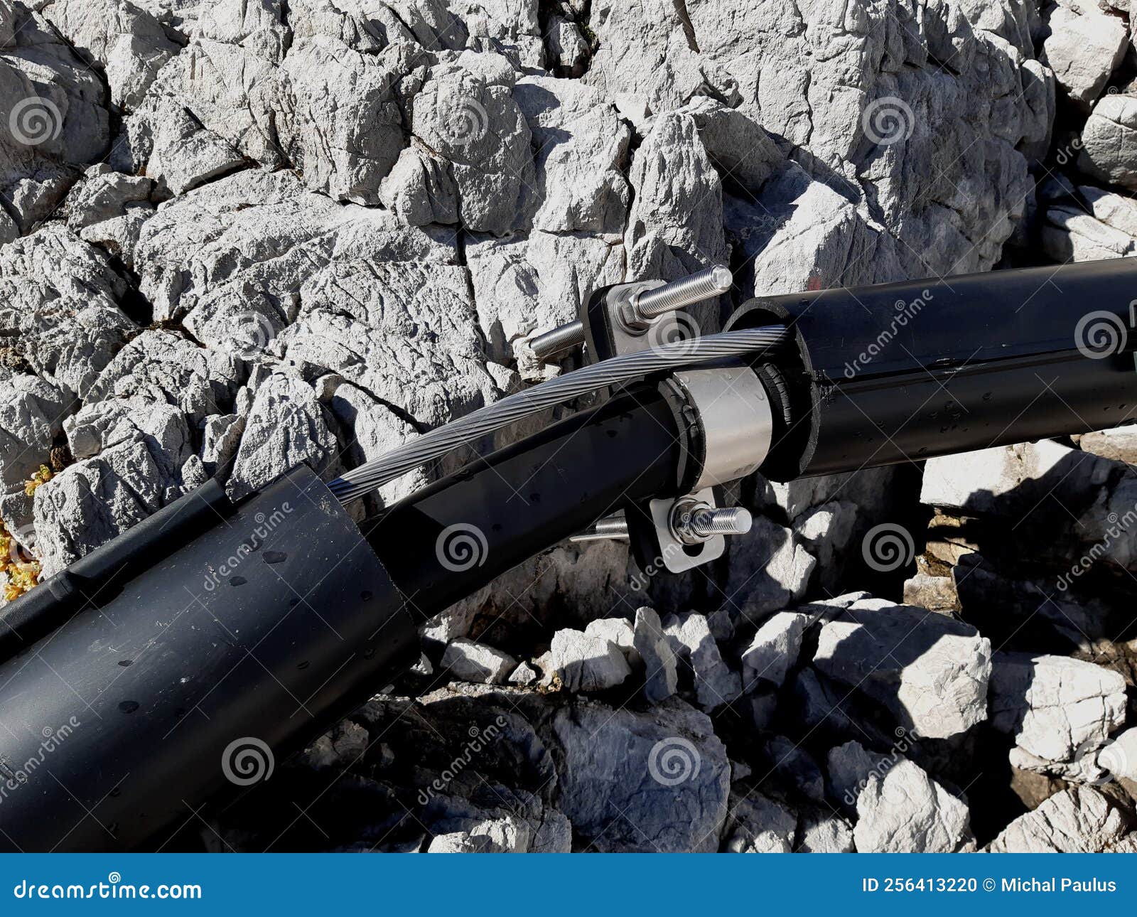 The High Voltage Cable is Attached To the Limestone Rock Using Stock ...