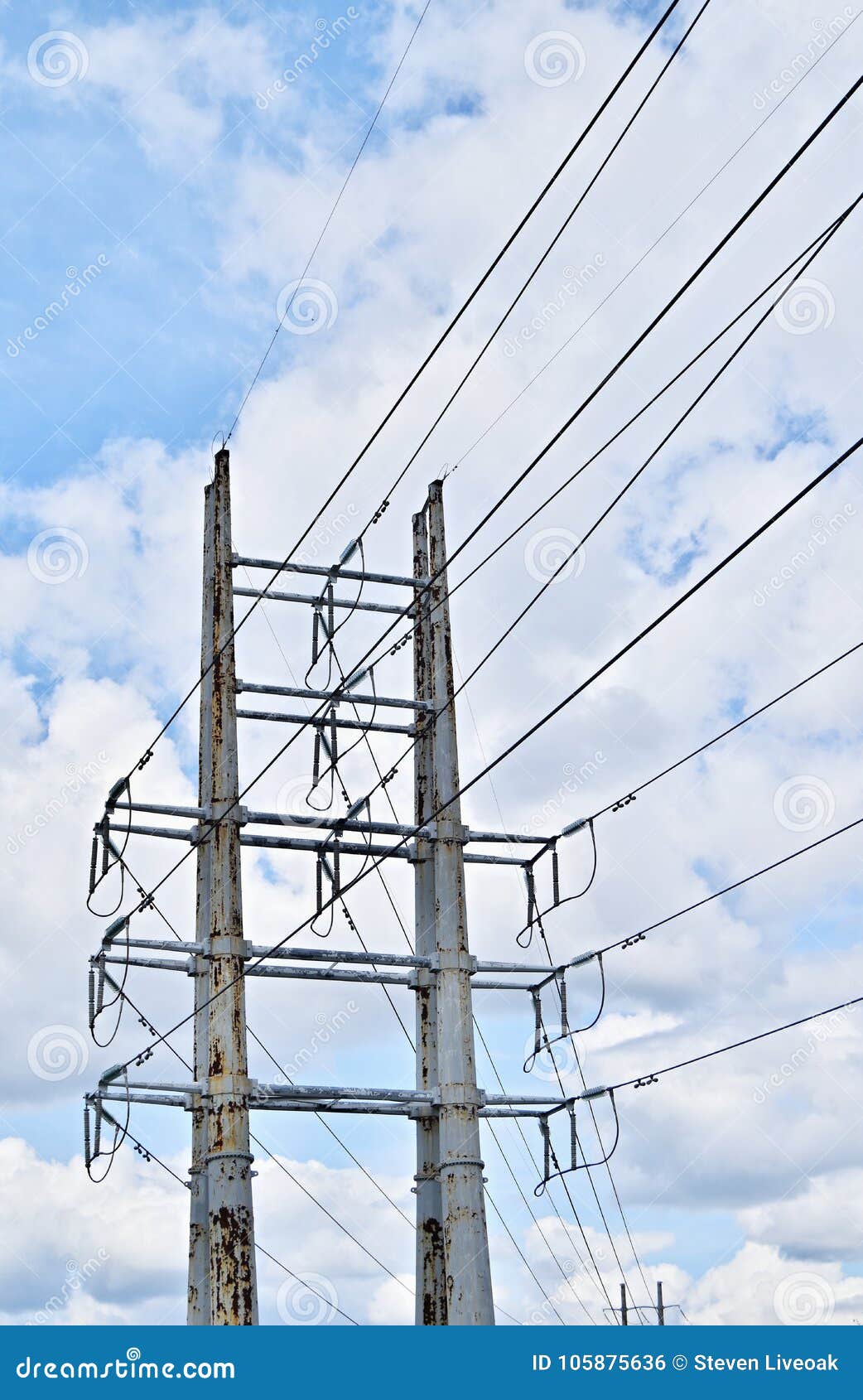 High Voltage Distribution Tower Under a Cloudy Sky Stock Photo - Image ...