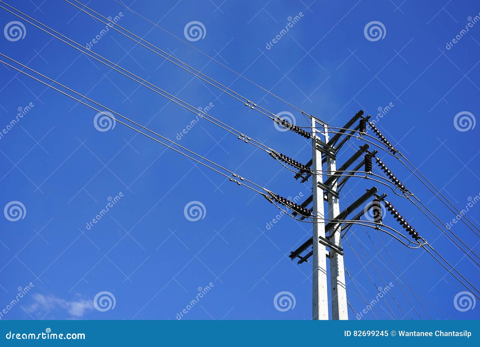 High Voltage Electric Post with Power Line Cables Against Blue S Stock ...
