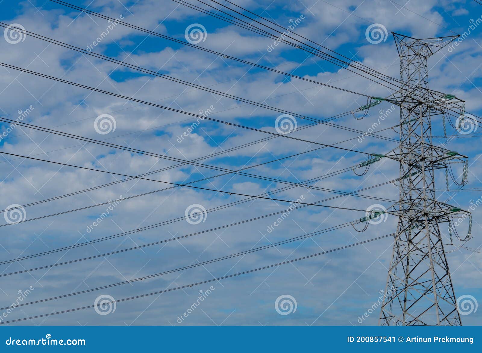 High Voltage Electric Pylon and Electrical Wire Against Blue Sky and ...