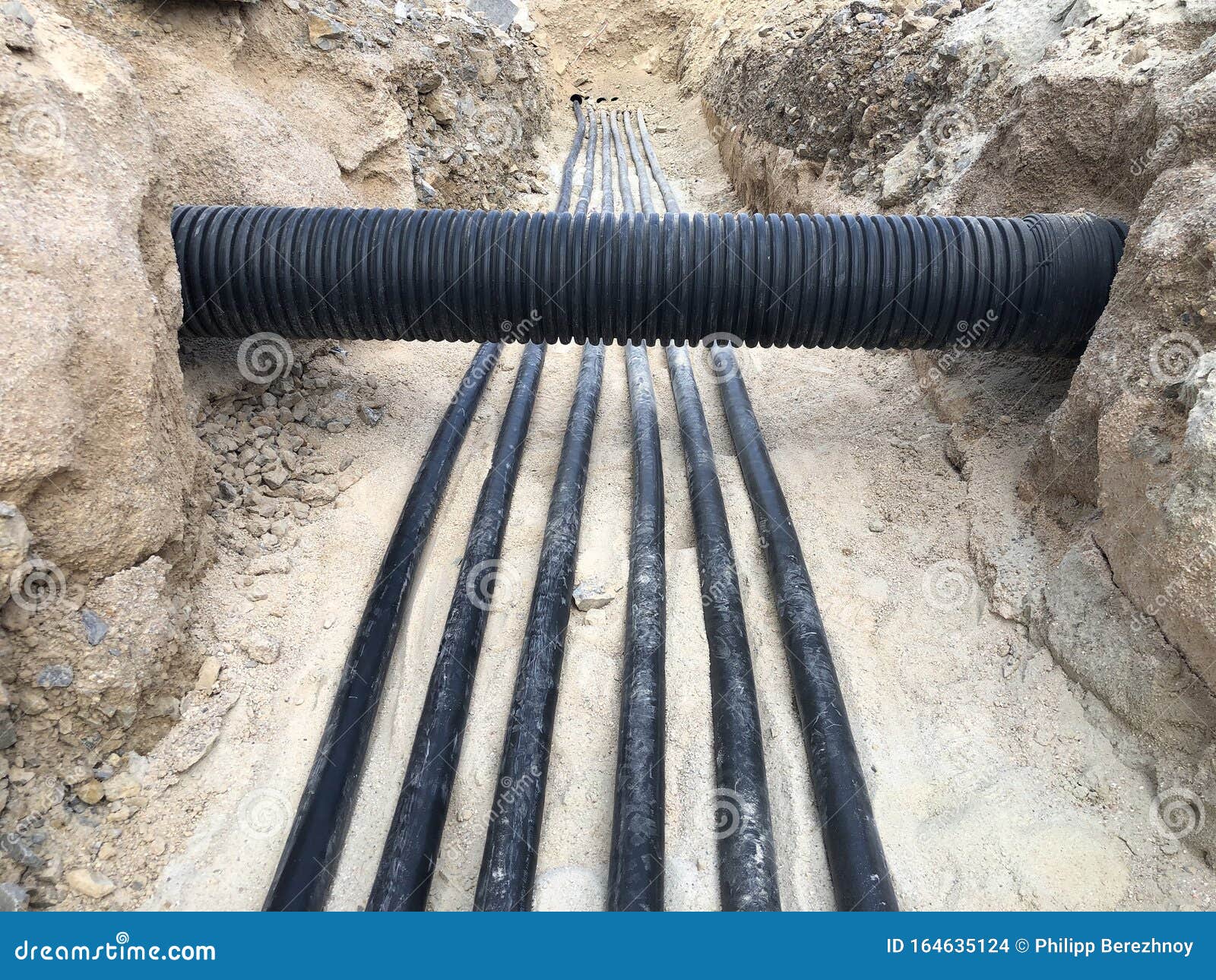 The High Voltage Electrical Cable is Laid in a Trench Stock Photo ...