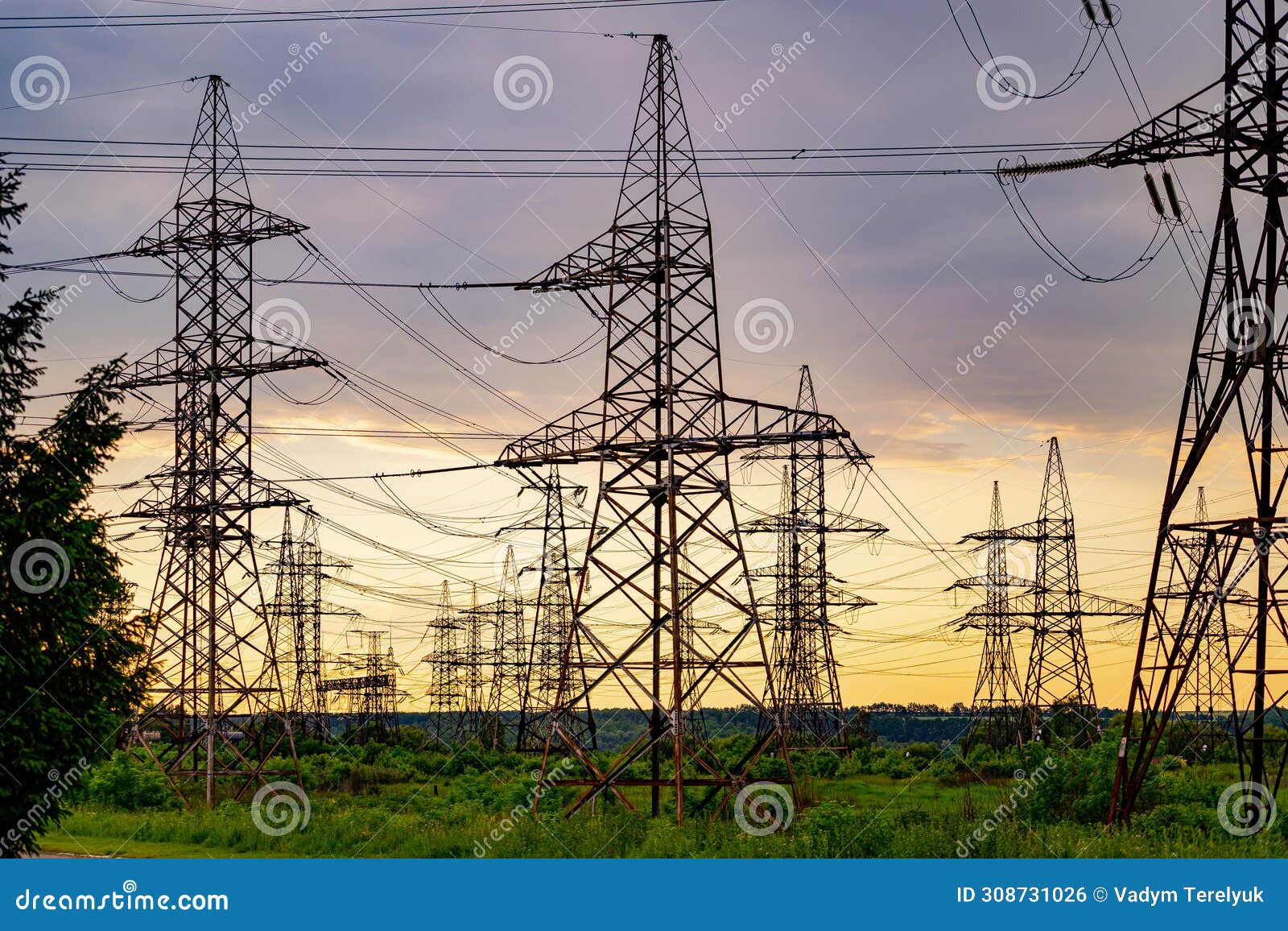High Voltage Electrical Substation Over Sunset Background with ...